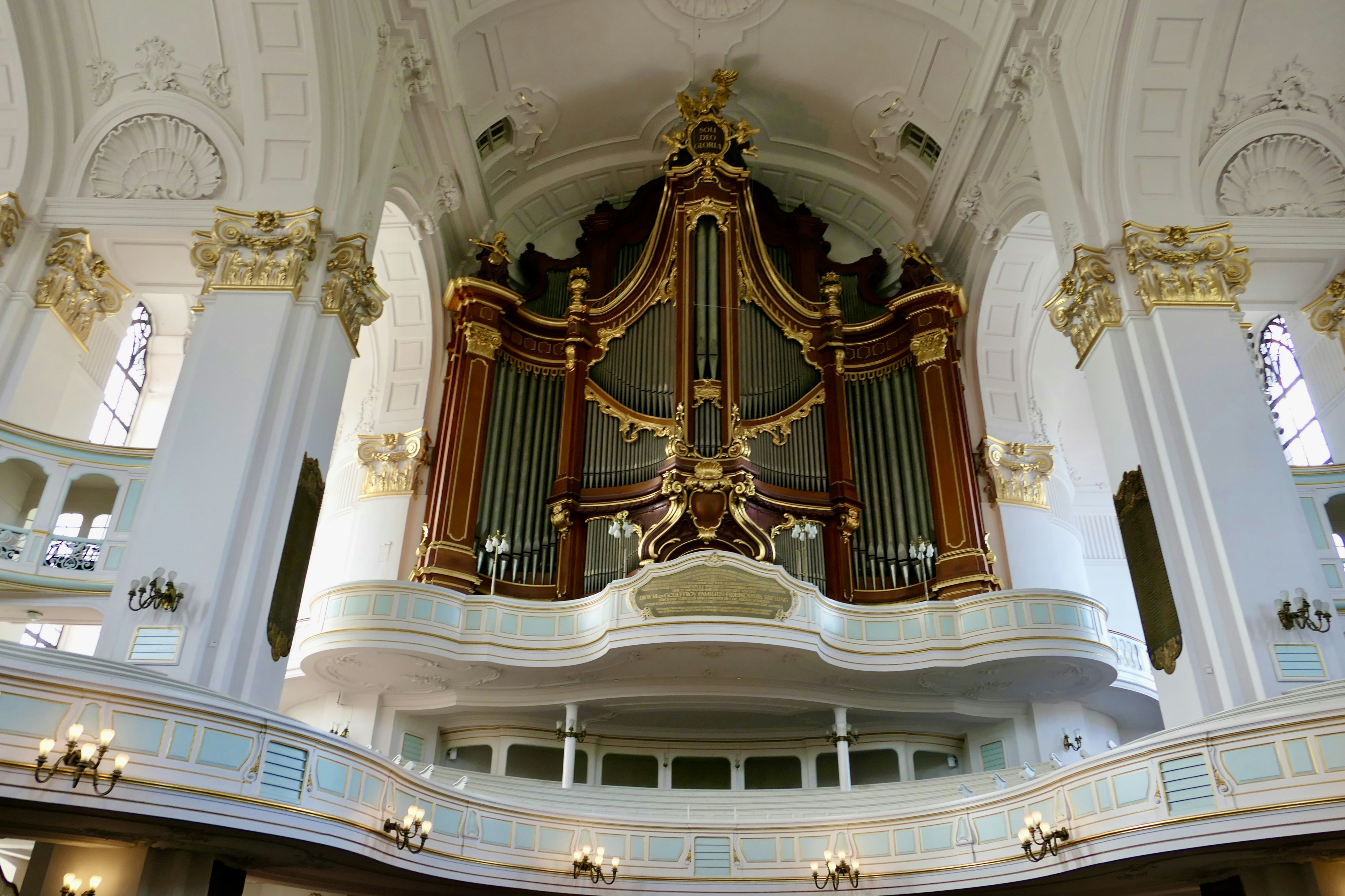 A grand pipe organ rests inside a beautiful church. photo – Free ...