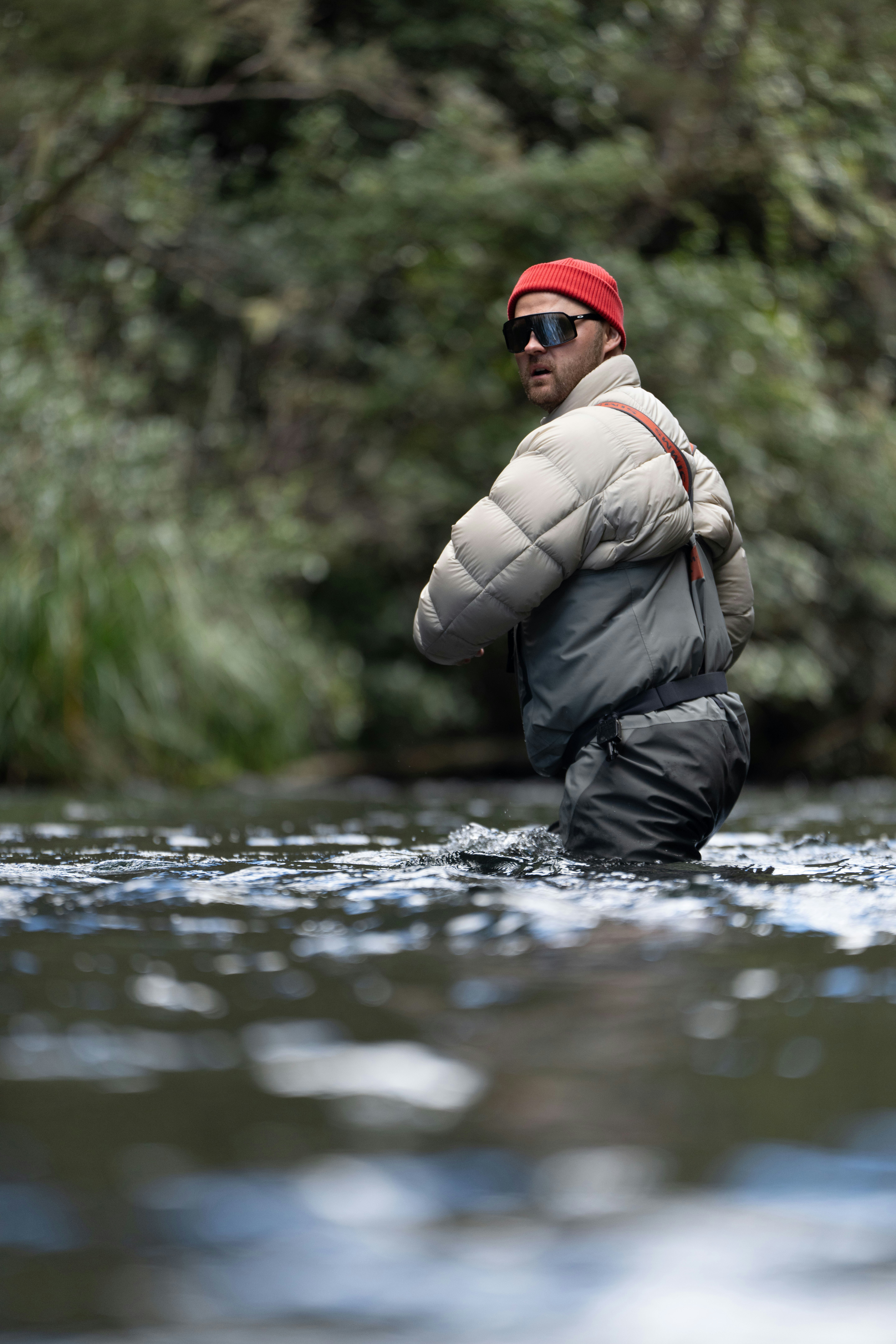 Wading Through Reflections: A Fisherman's Journey