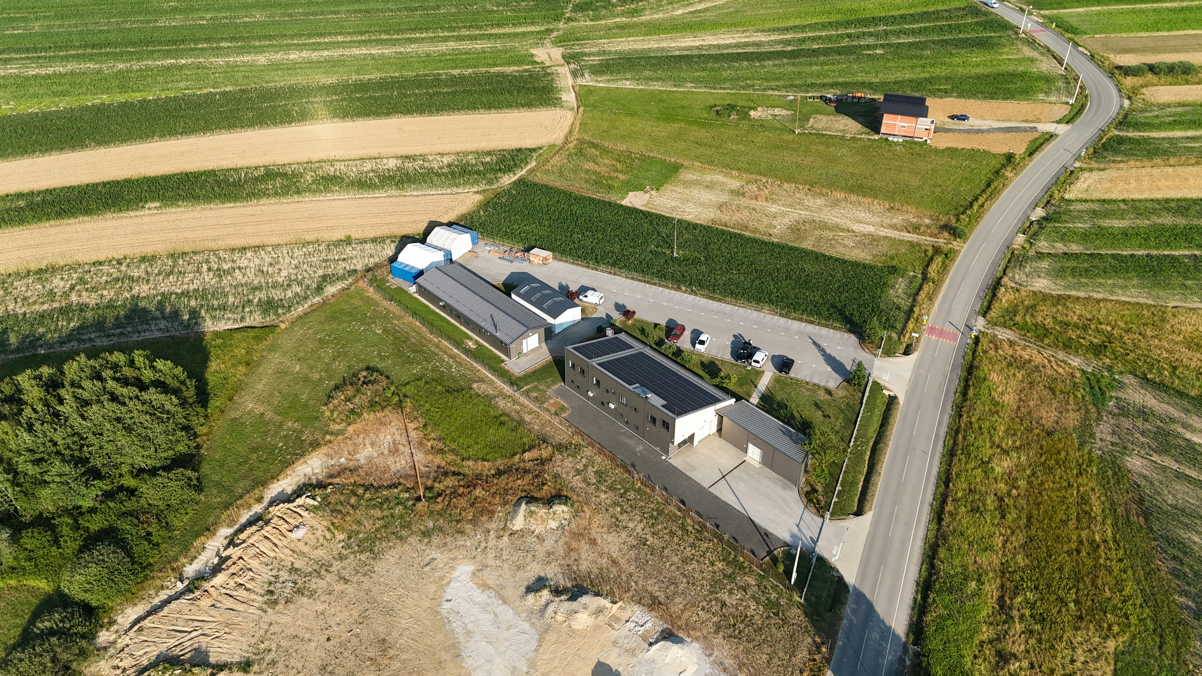 An aerial view of farmland and buildings.