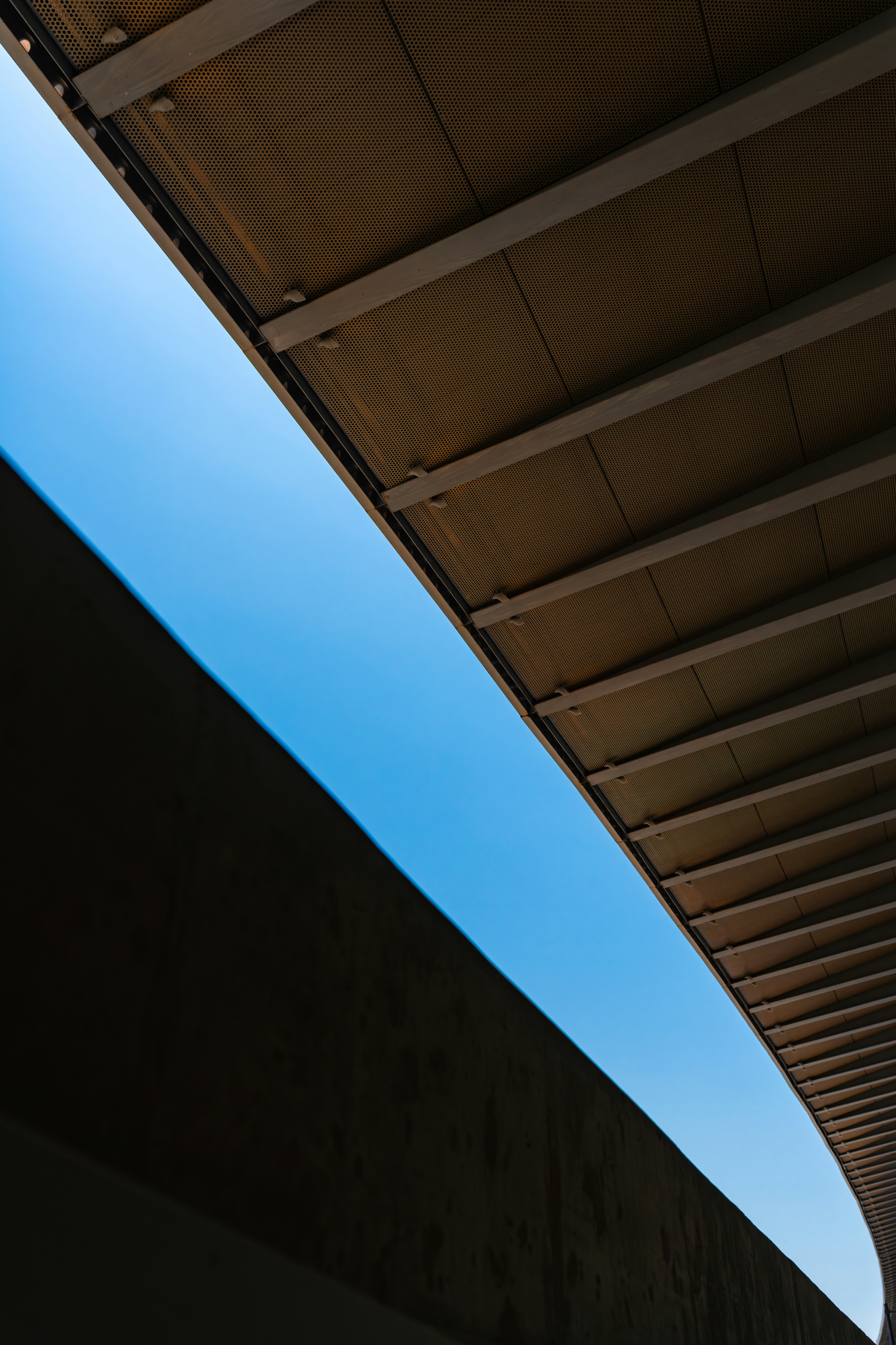 Looking up at the sky through architecture.