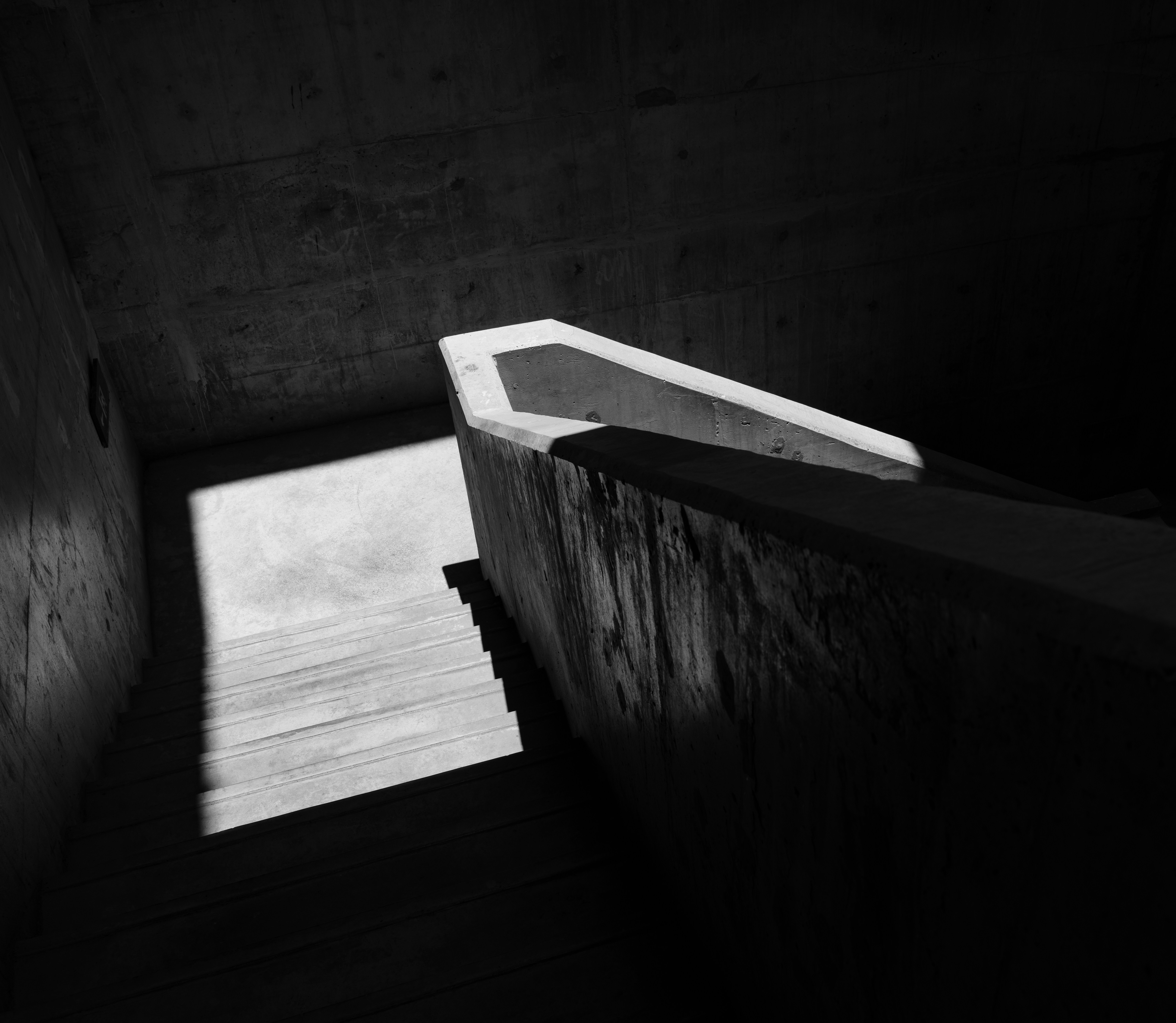 Light shines at the foot of the staircase.