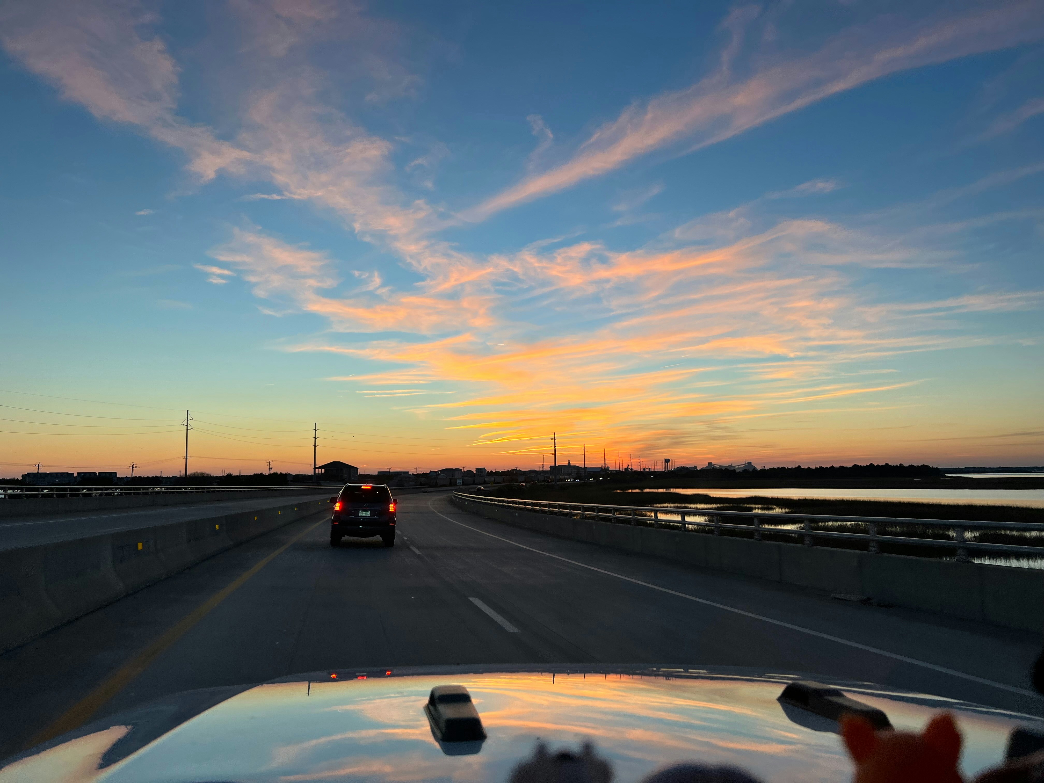 Sunset | Driving towards a beautiful sunrise on the road.