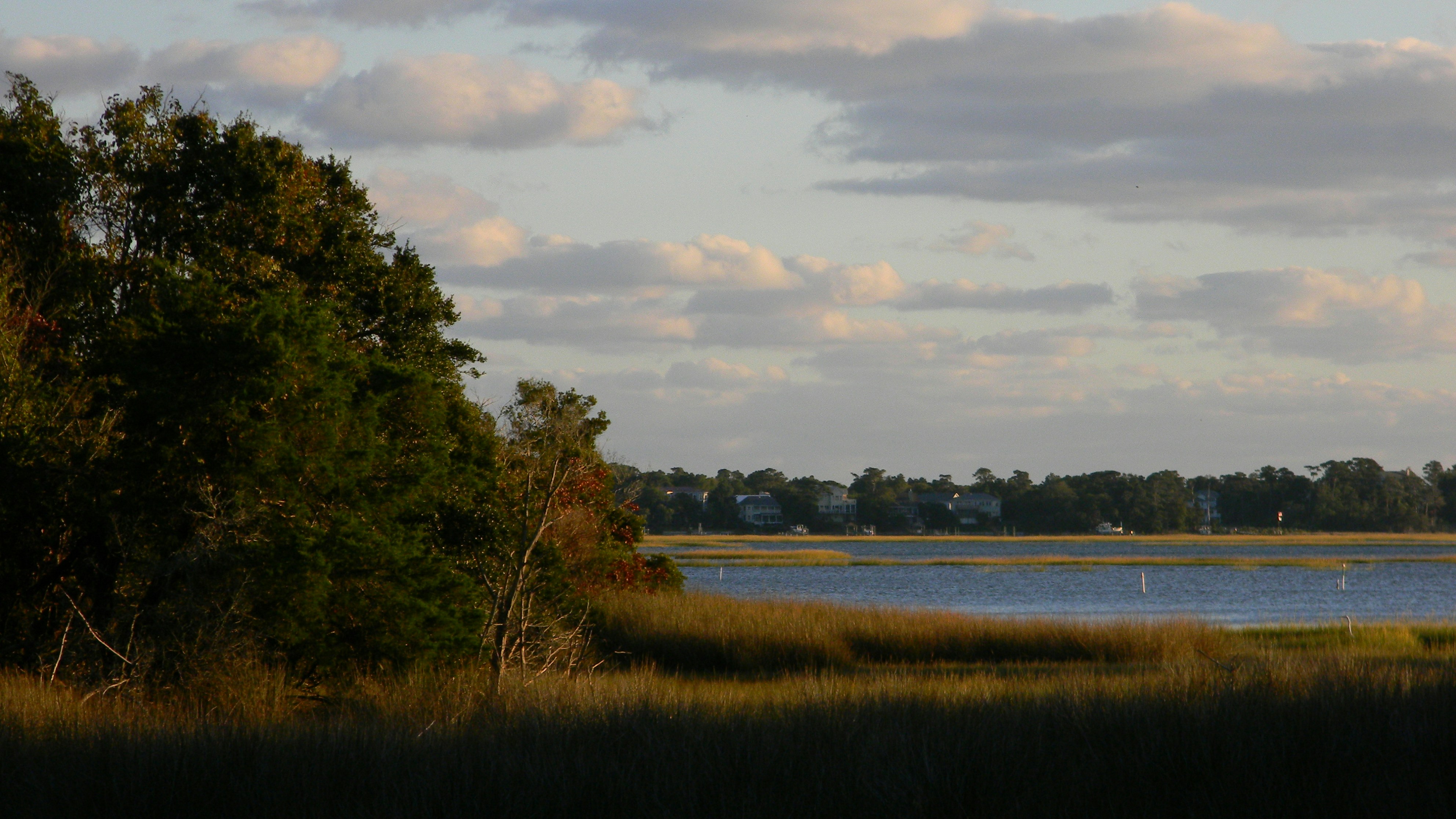 Intercoastal waterway. Sound View. | A peaceful waterscape with trees and clouds.
