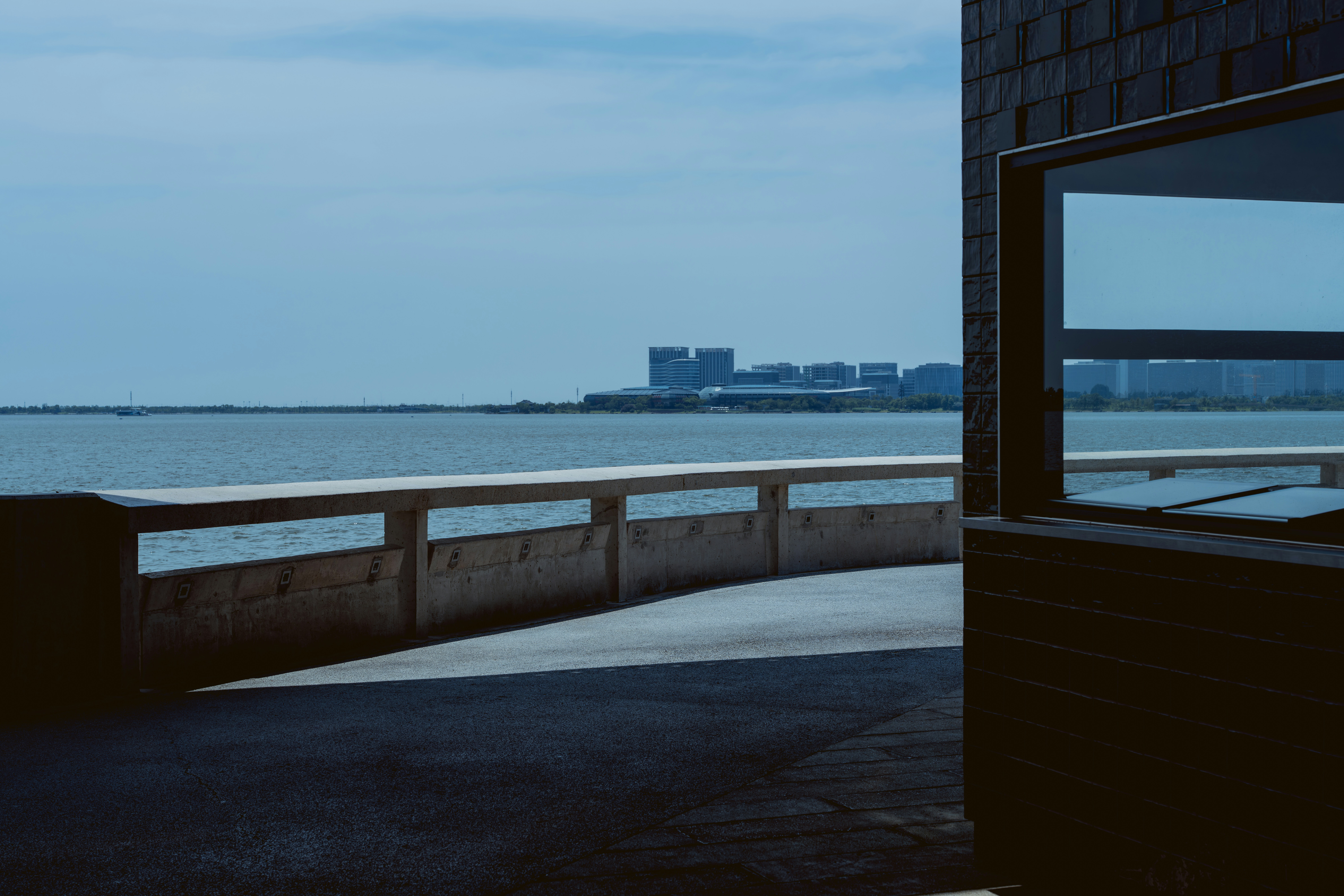 Quiet Blue Hour Waterfront: Distant City on the Horizon