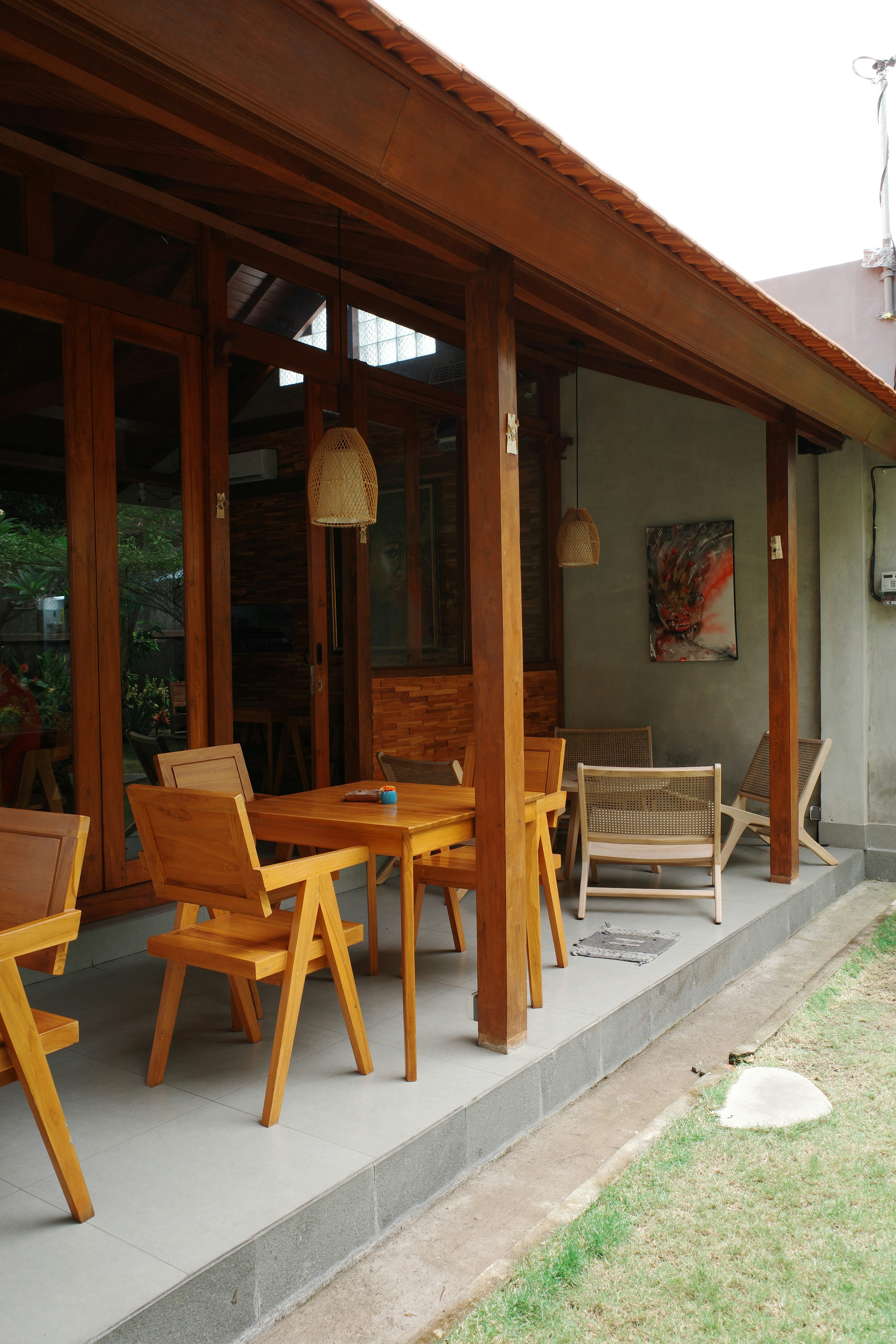 Timber Terrace Café: Afternoon Light Framing a Cozy Outdoor Lounge