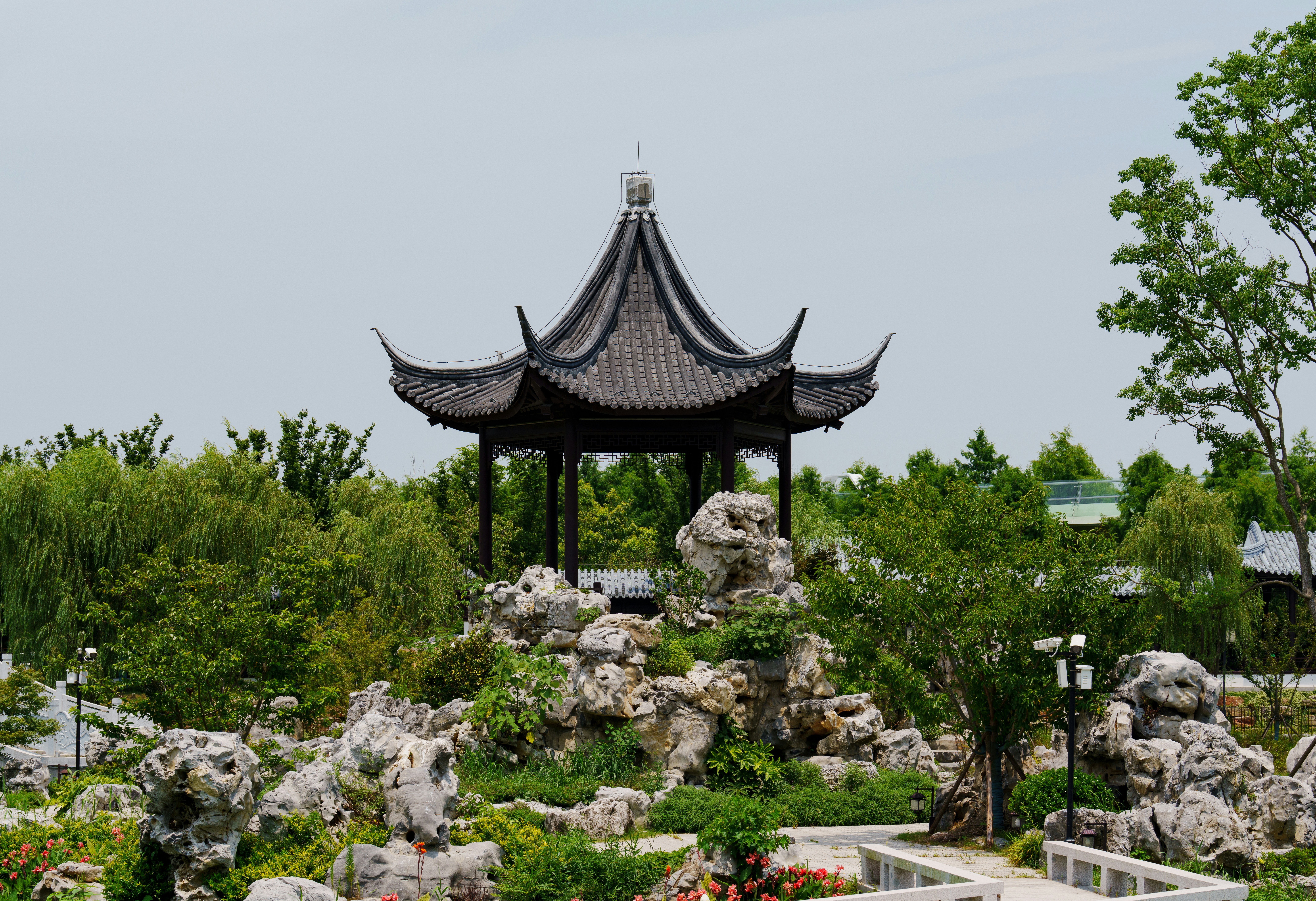 Pavilion Among the Rock Garden: Tranquil Geometry in a Chinese Landscape