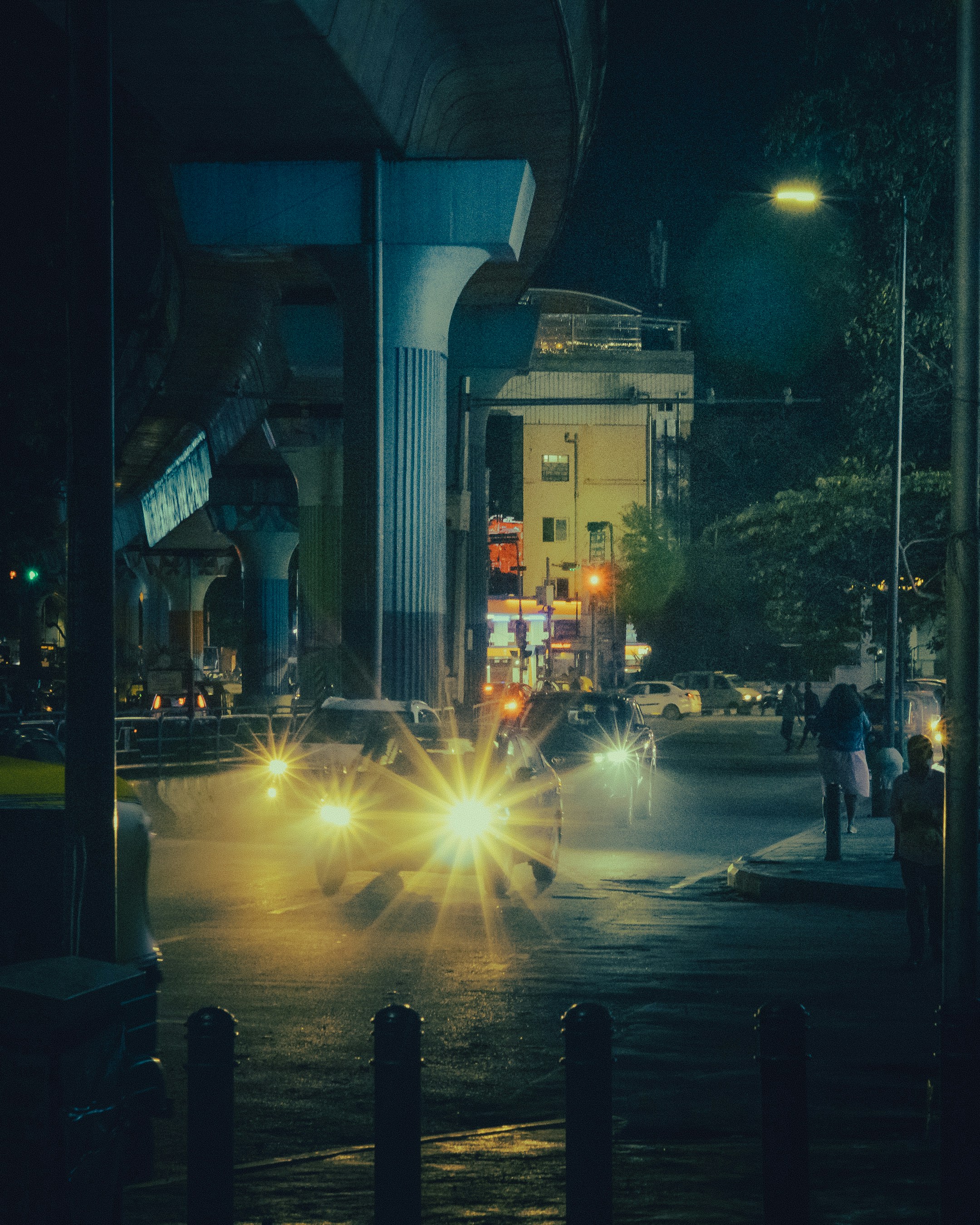 Night of Banglore roads | Cars drive on a city street at night.