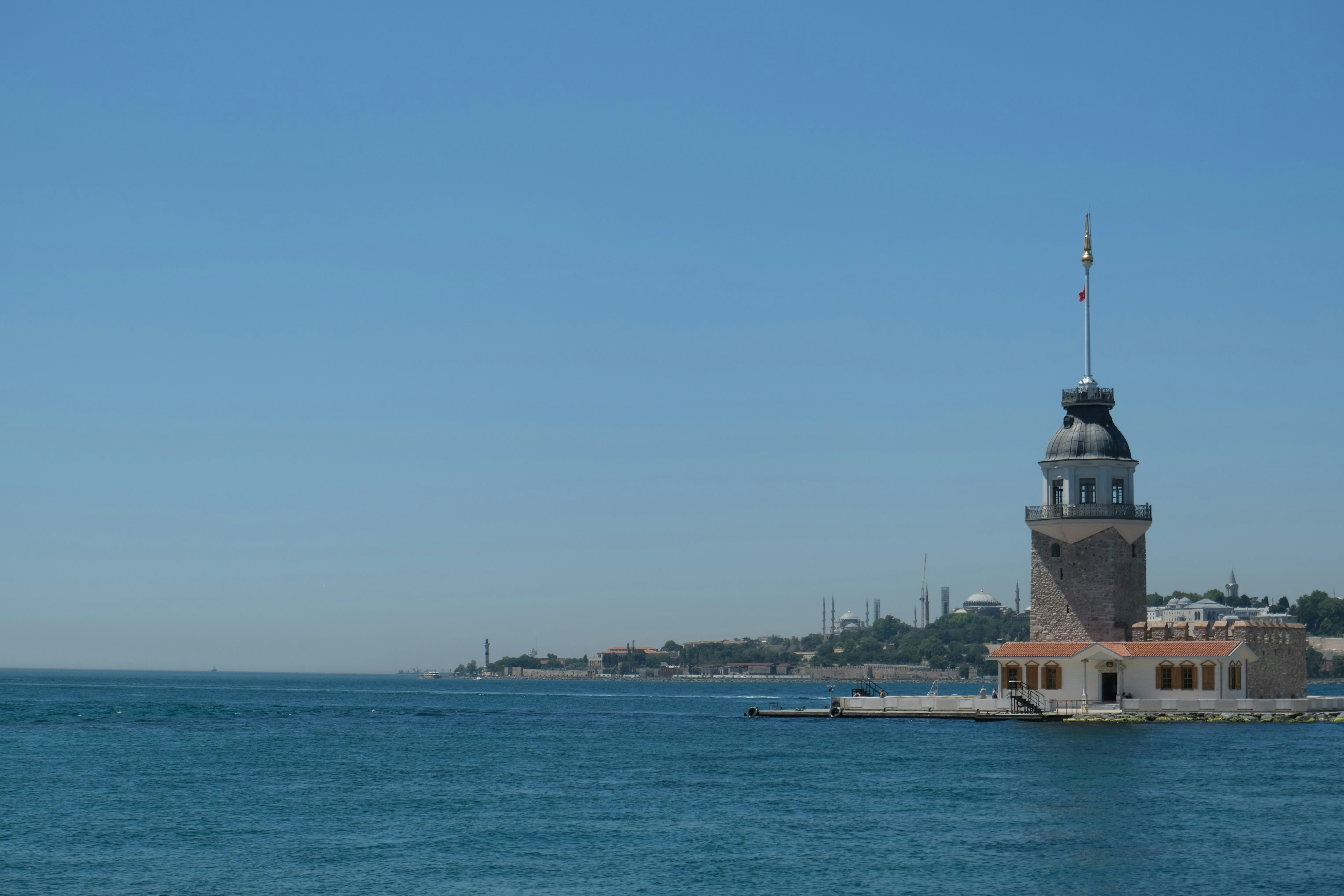 Maiden's tower sits in the turkish sea.