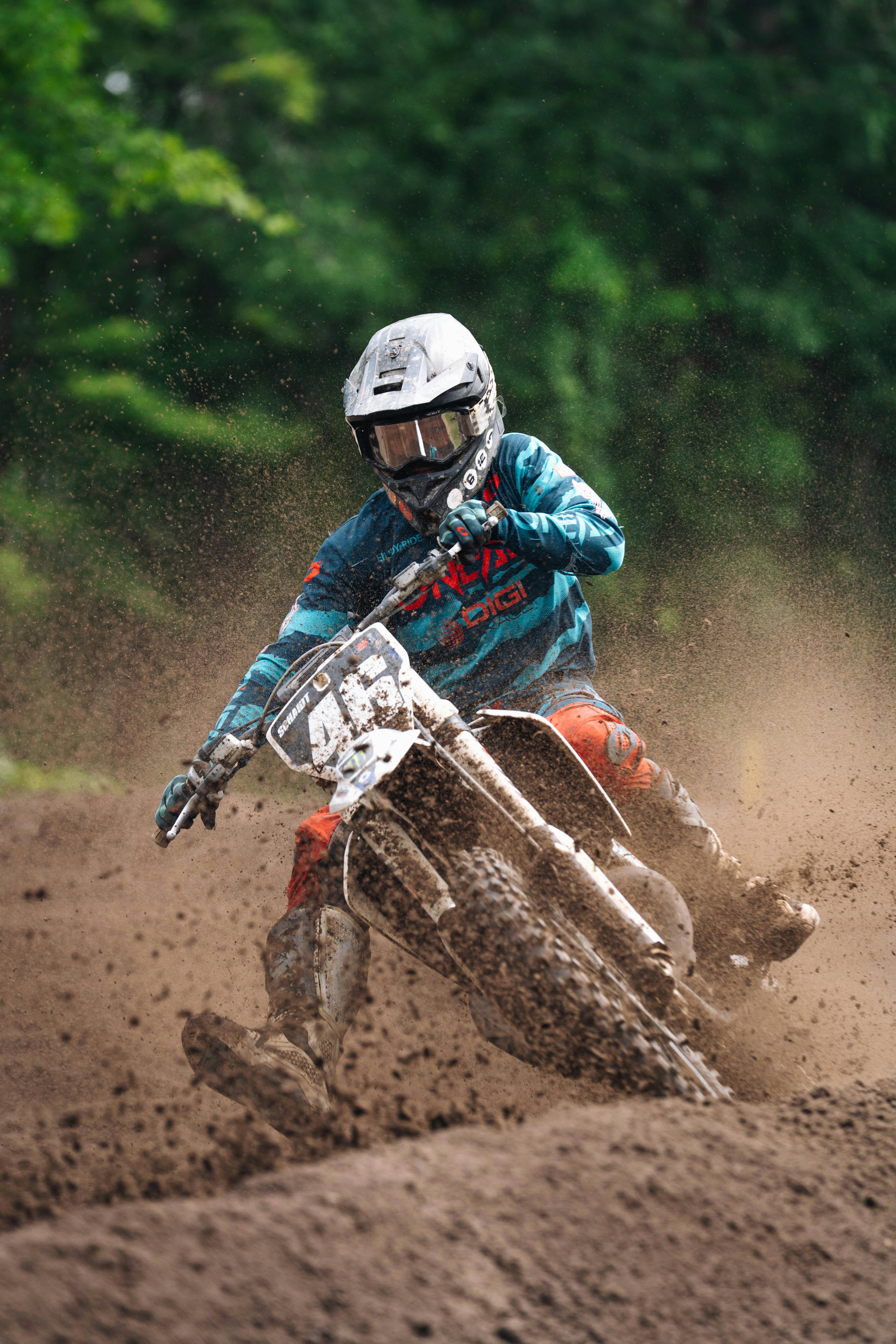 A motocross rider speeds around a dirt track. photo – Free Michigan ...