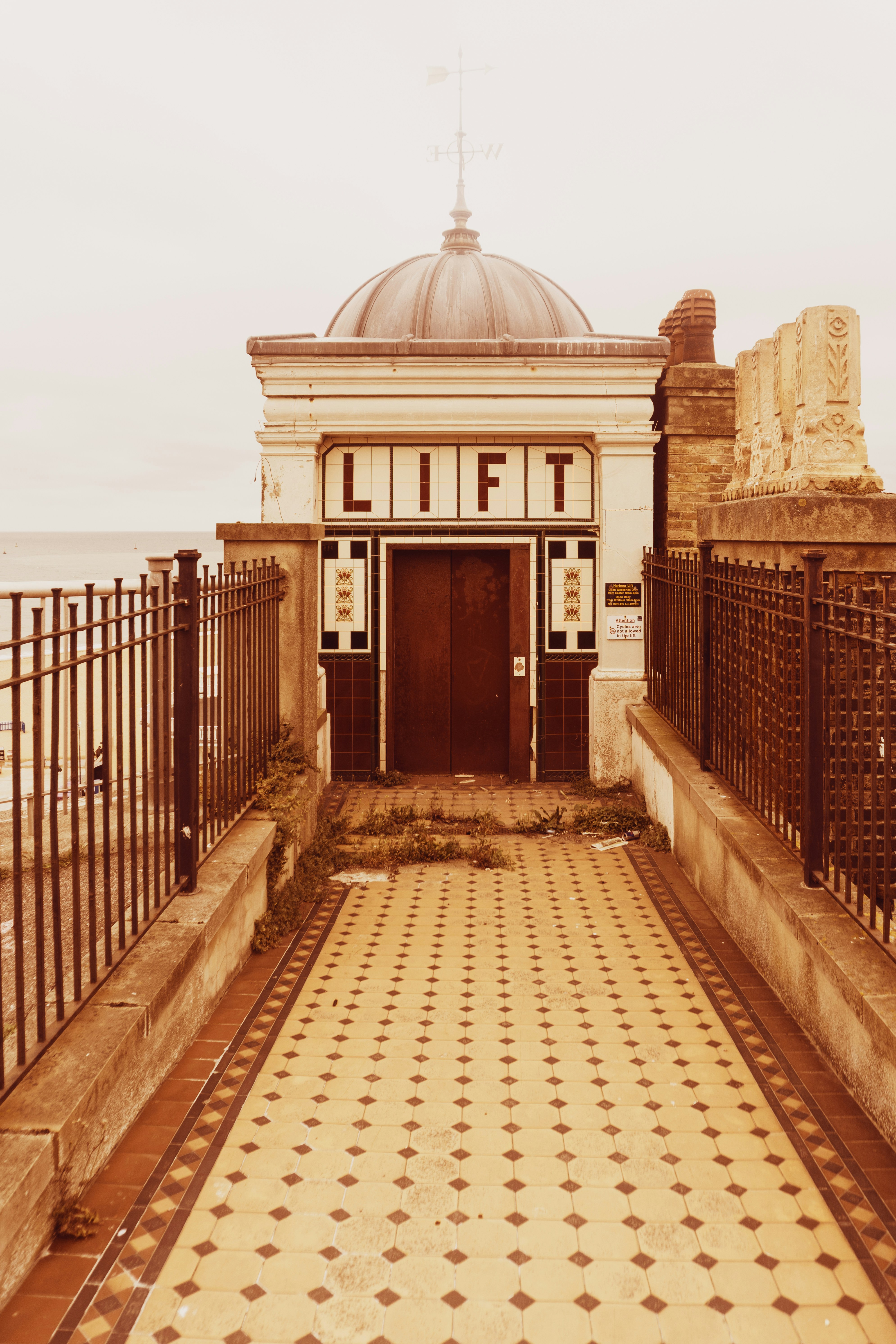 Ascent to the Seaside: A Vintage Lift Entrance