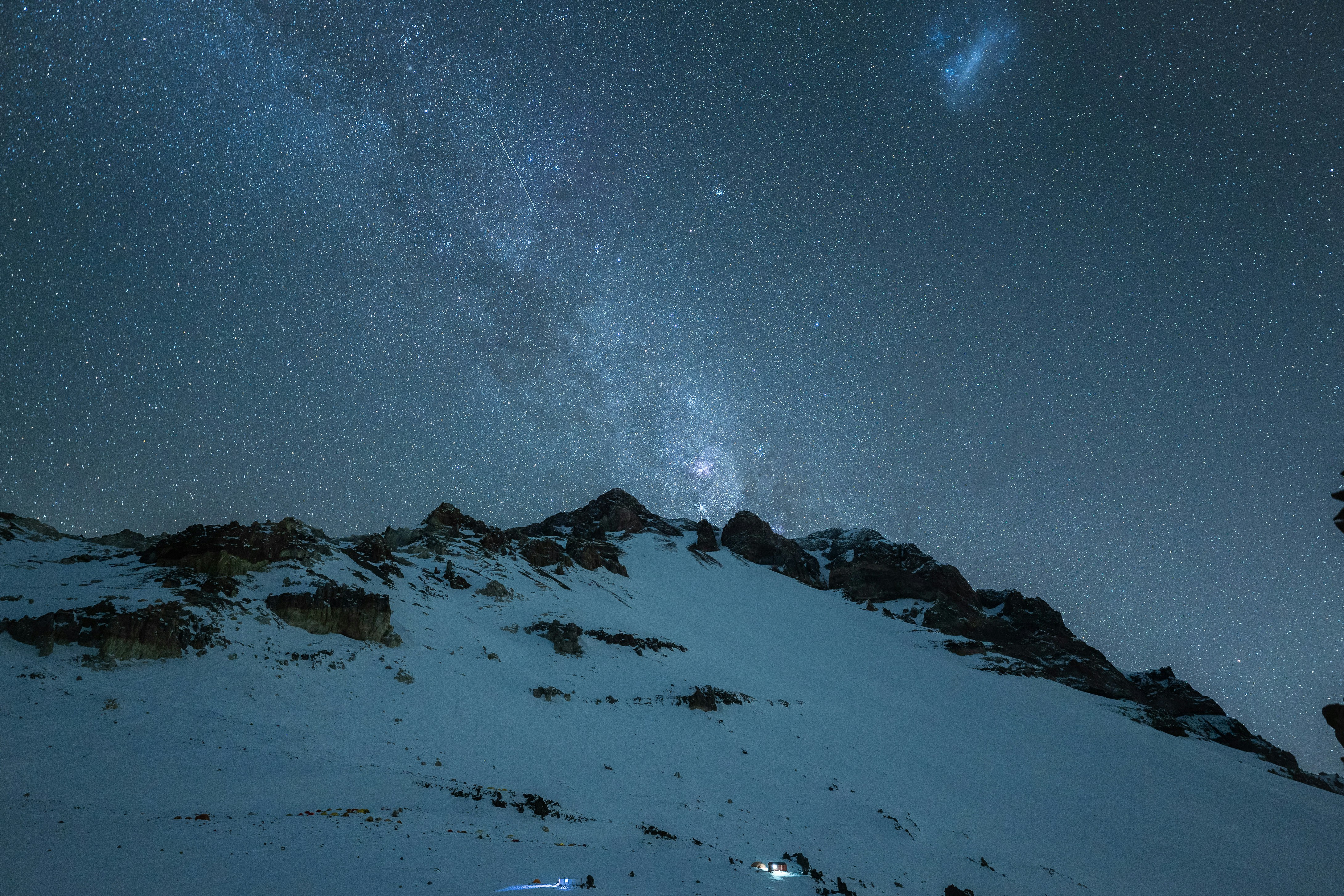 Celestial Symphony Over Snow-Capped Peaks