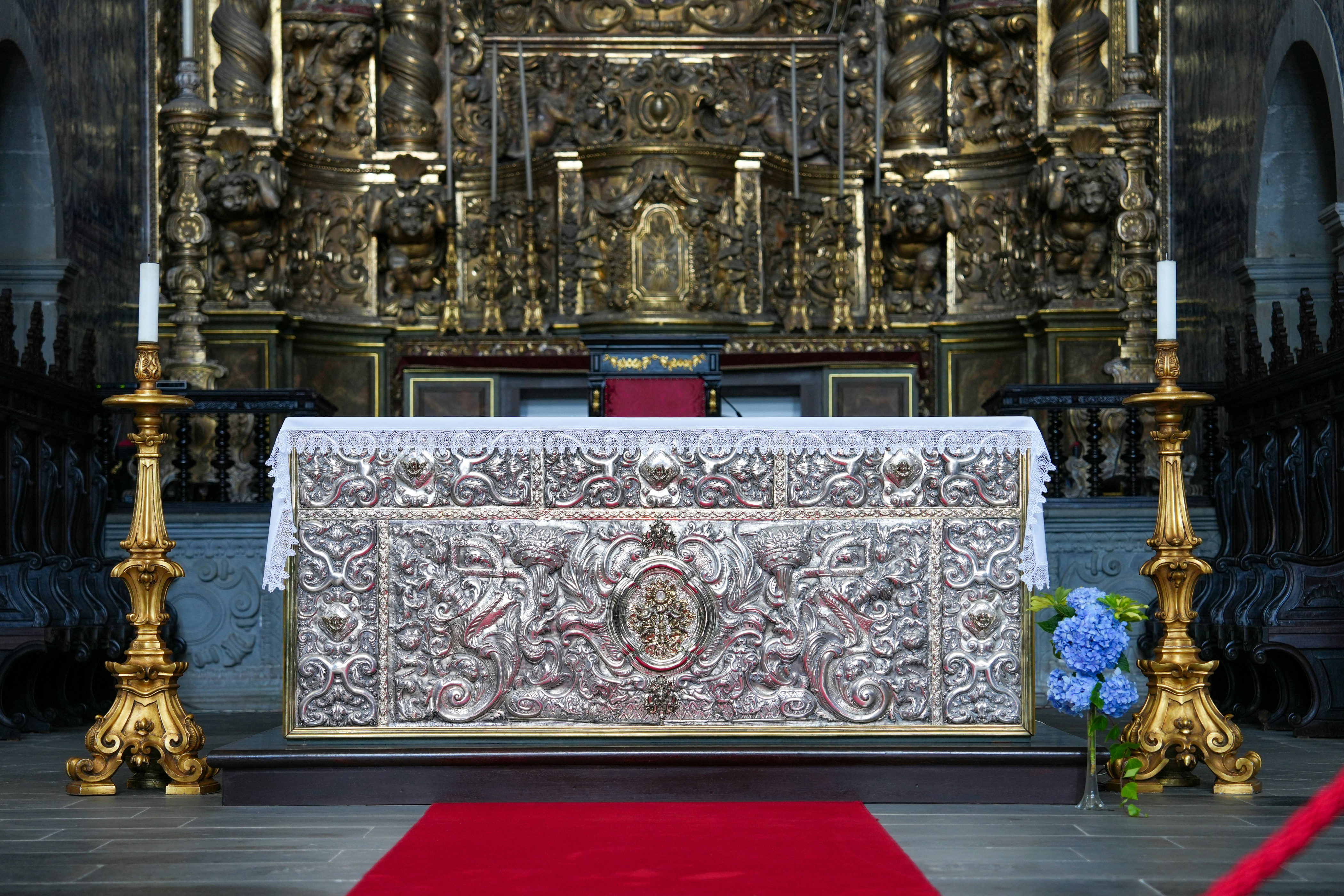 An elaborate altar, richly decorated in a church.