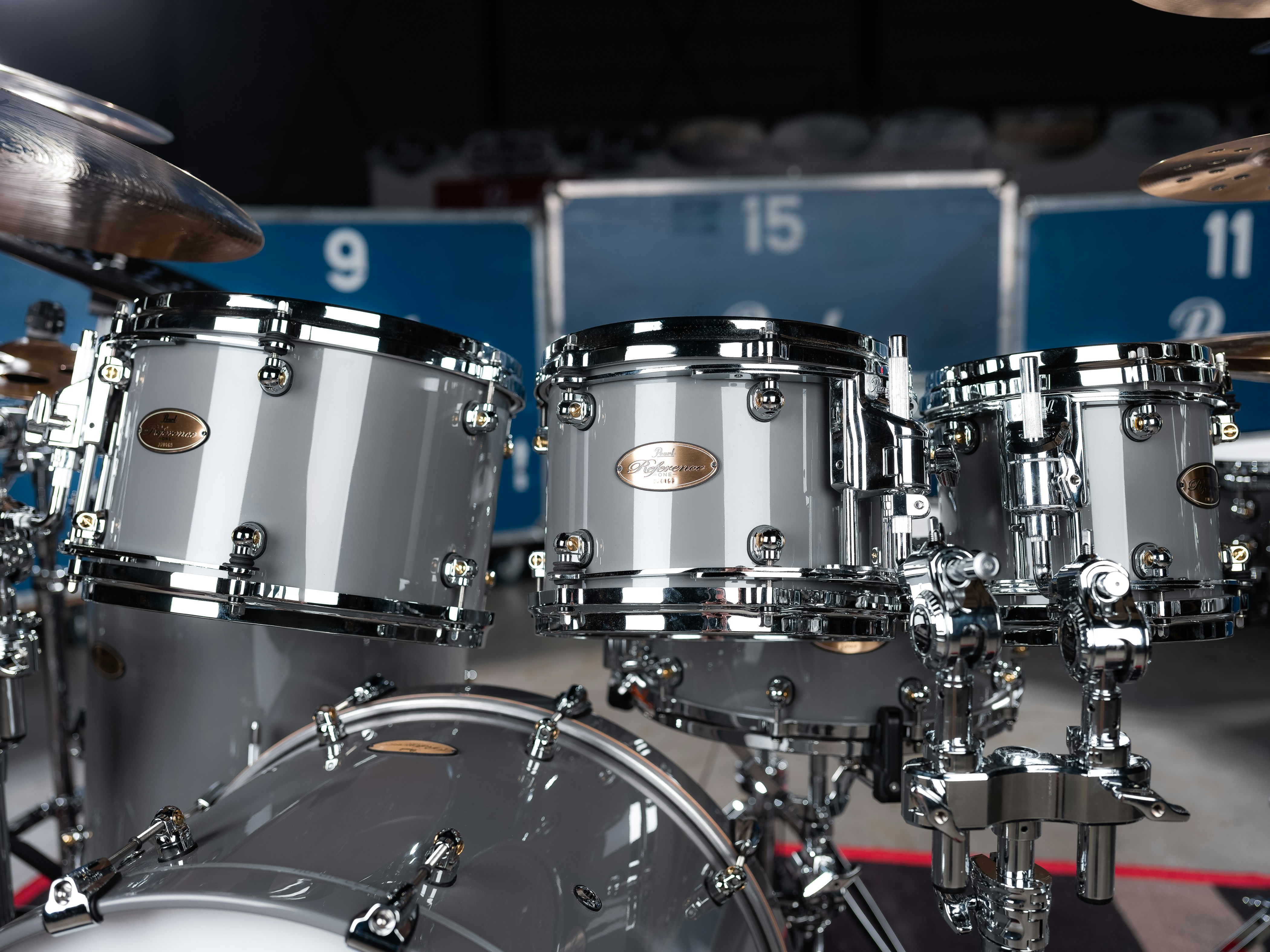 RF1P924XSPLC Reference One 859 Putty Grey + 8" Tom + 18" Floor Tom RF1P1450SC RF1P1465SC TC1035BL BC1030 P3052 Demon XR H2050 S1030 | A shiny, silver drum set is pictured.