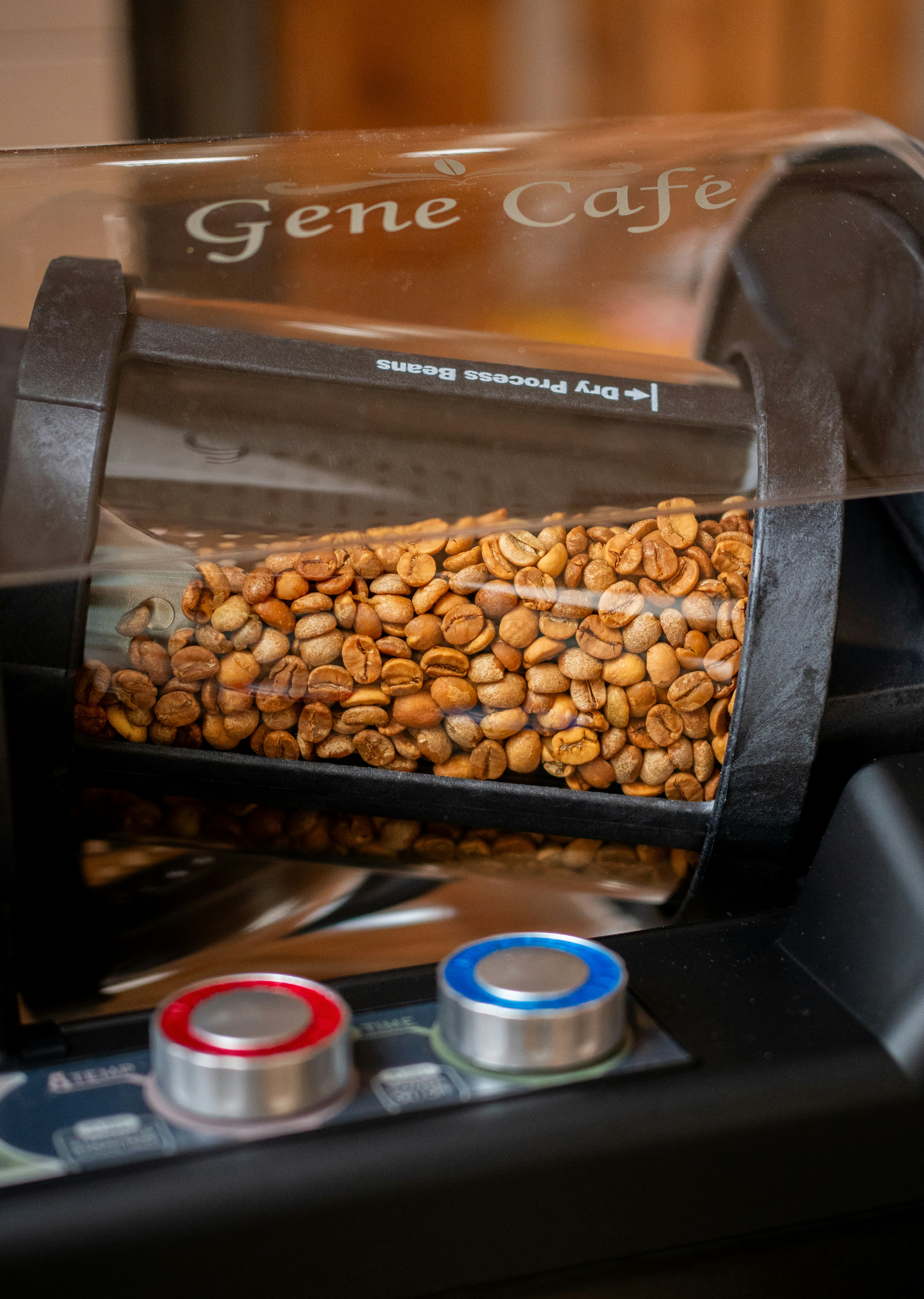 Coffee beans roast in a gene cafe machine.