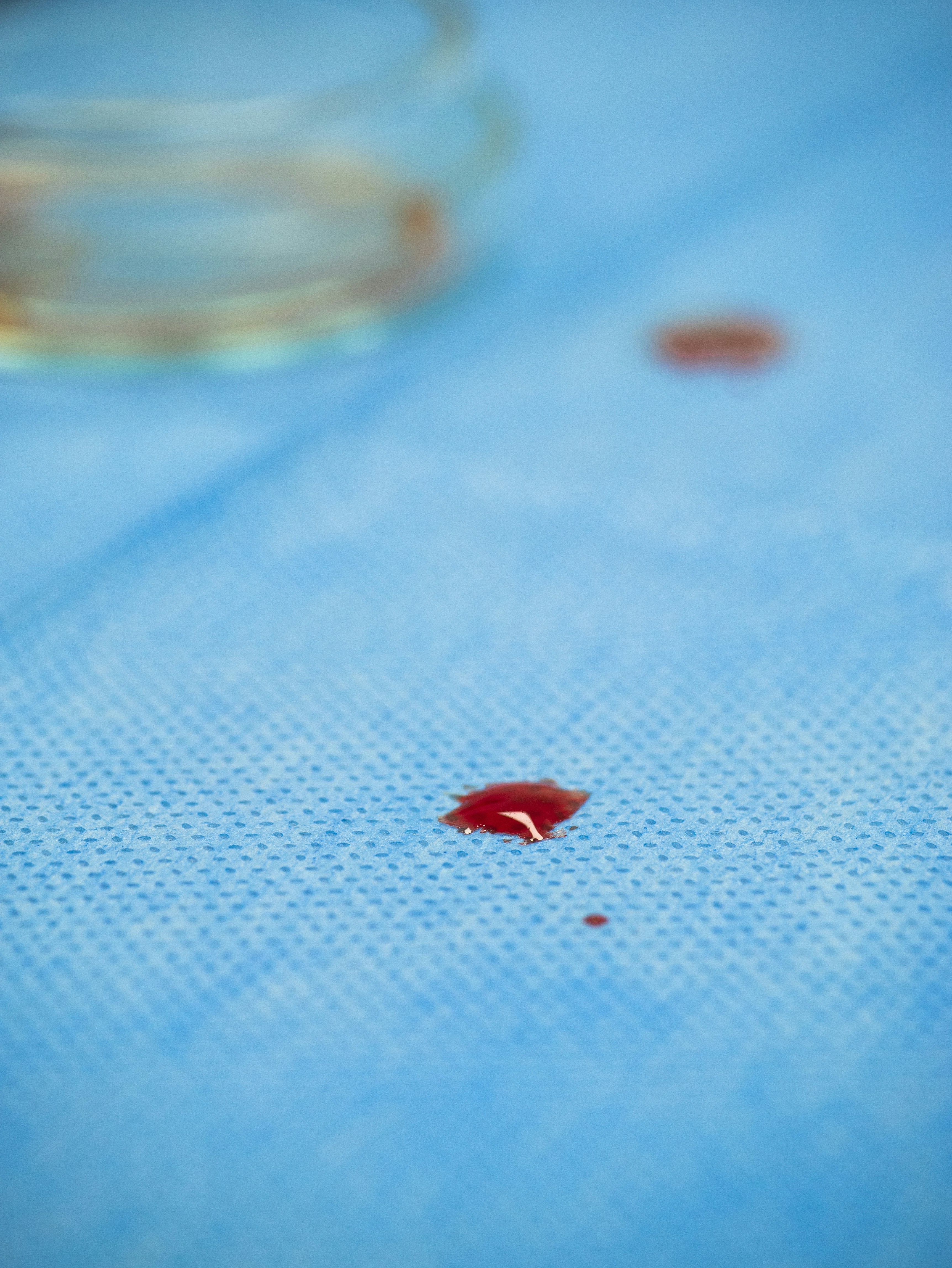 Blood drops stain a blue, surgical table. photo – Free Background Image ...