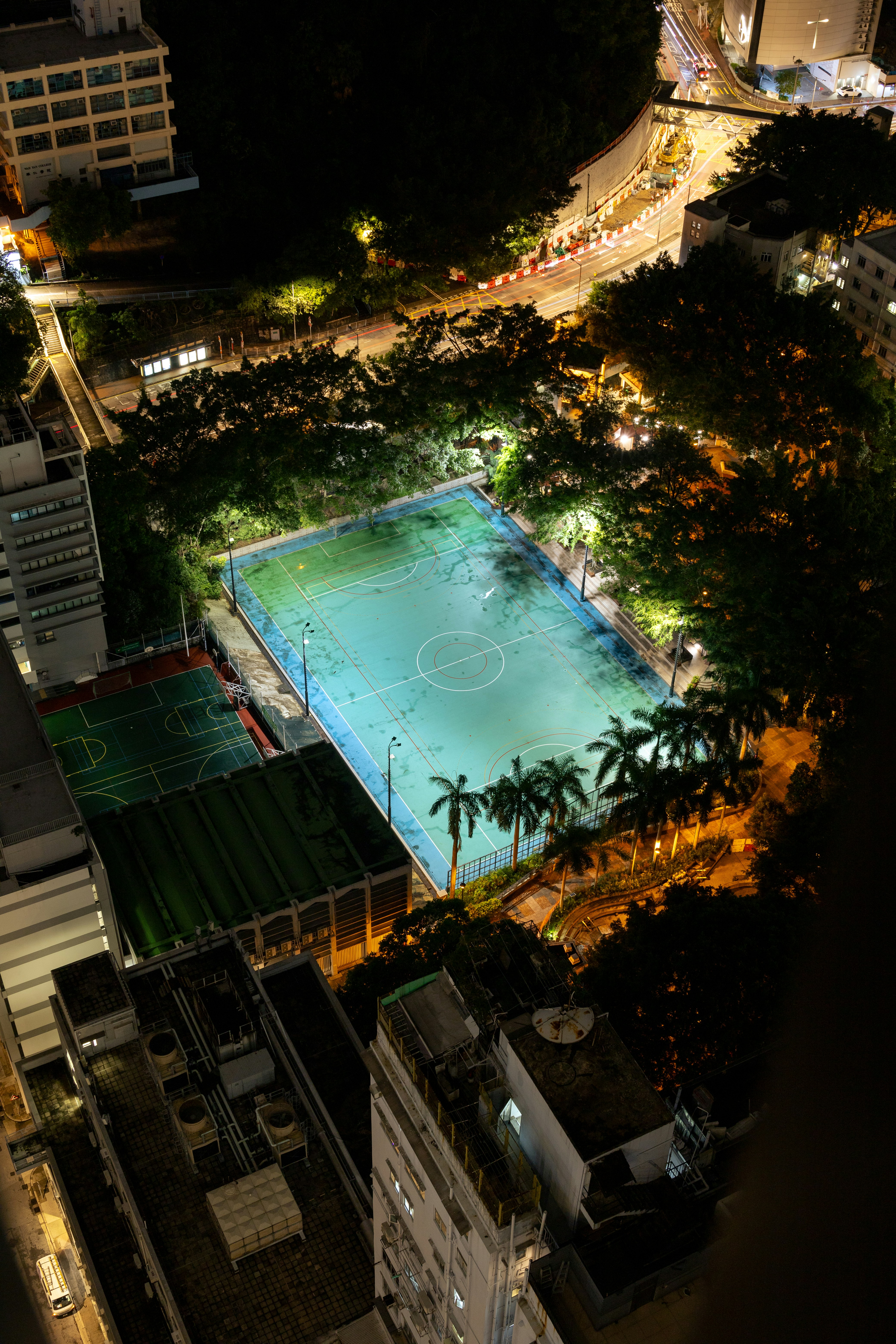 Night view of a lit sports complex.