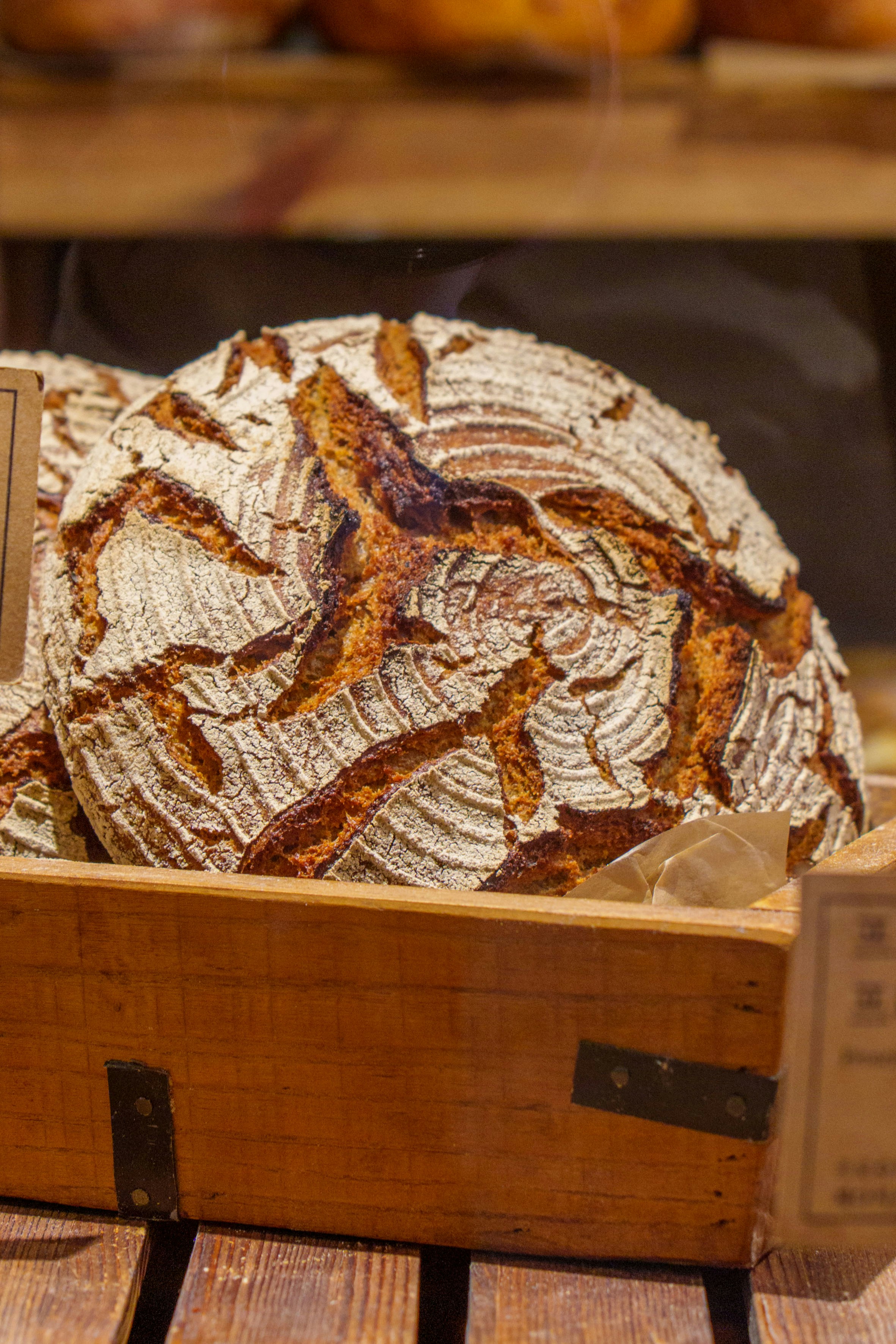 Crackled Artisan Bread in a Wooden Bakery Crate
