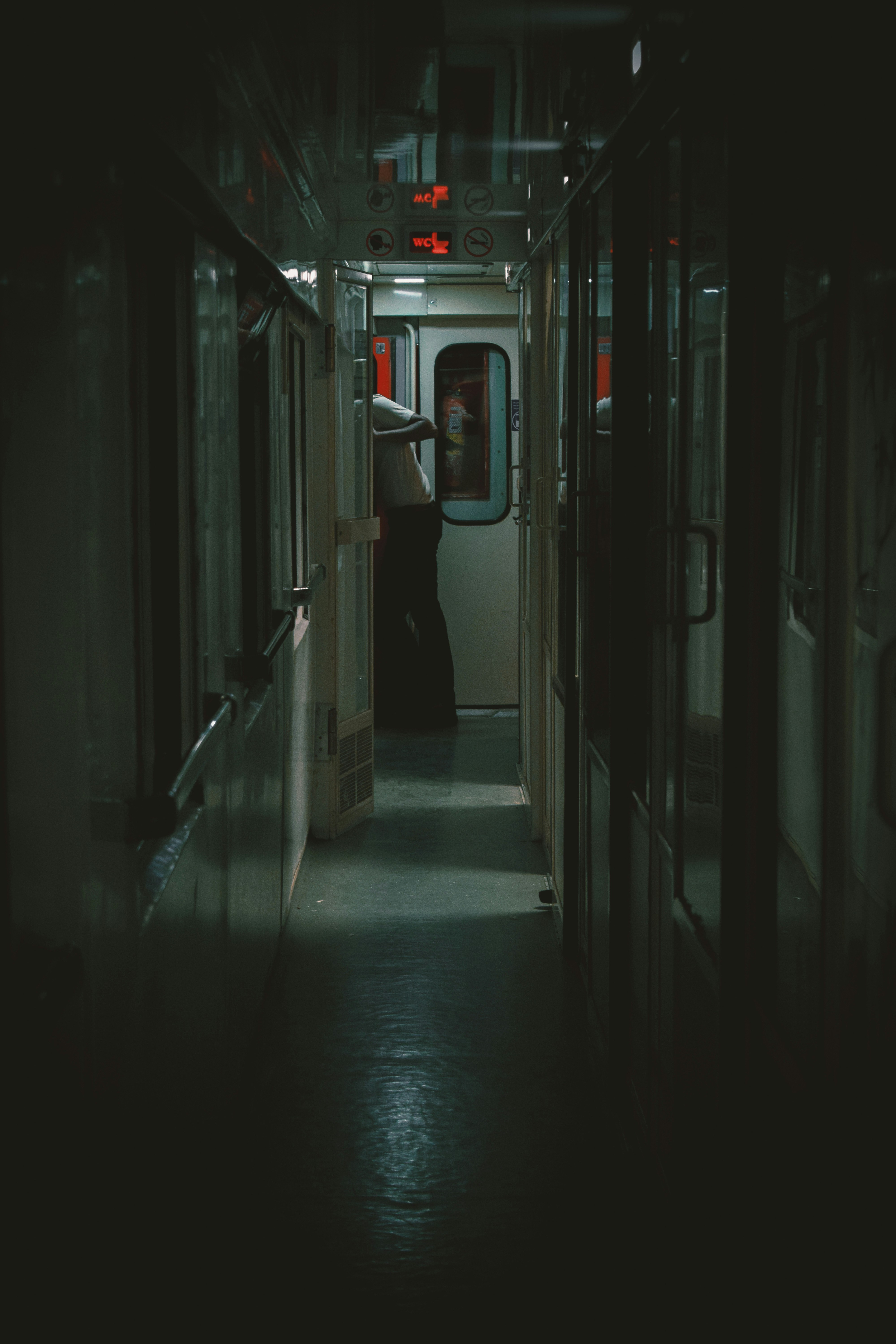 Inside of a dim, empty train car.
