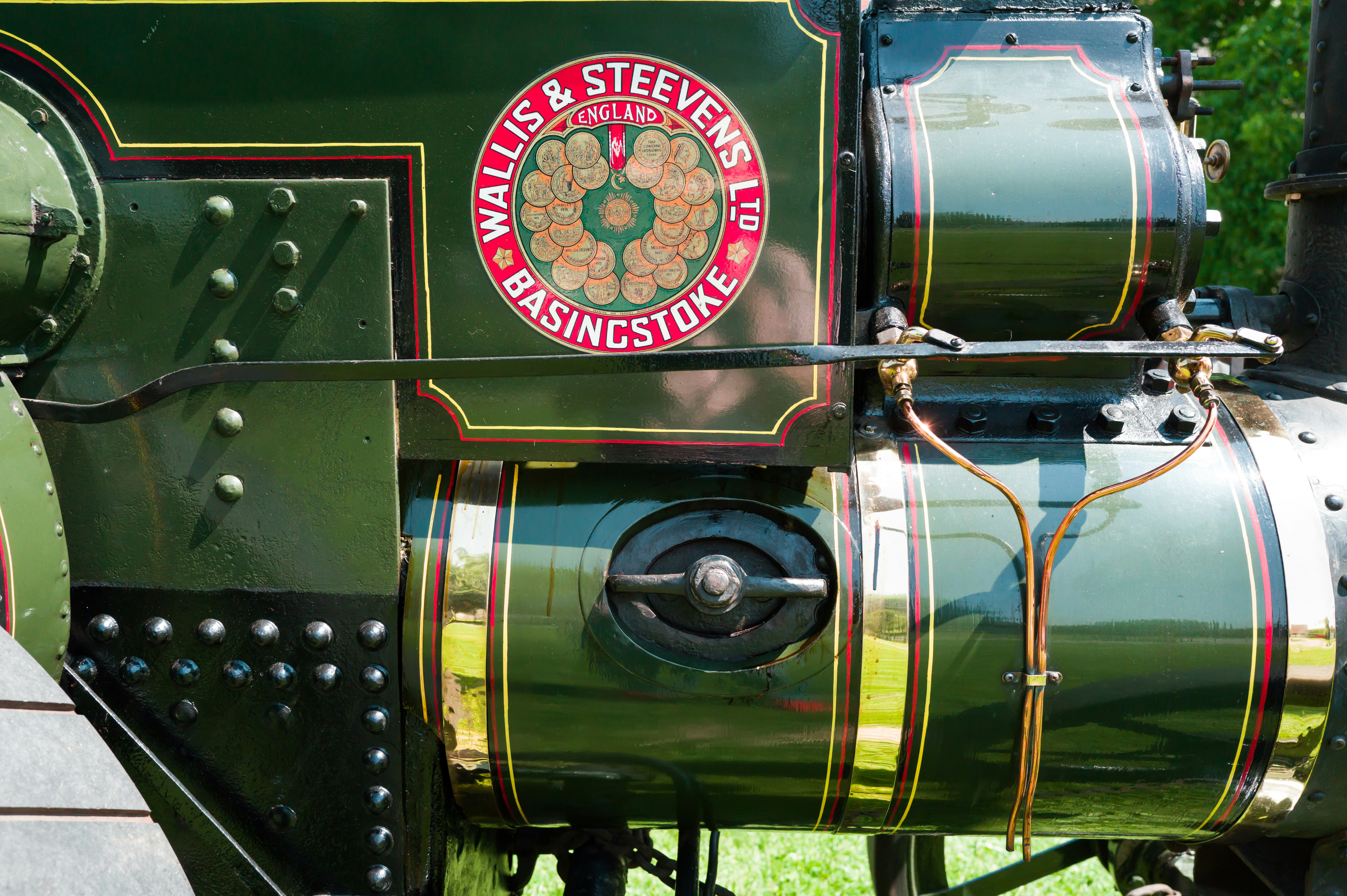 Polished Green Steam Engine: Wallis & Stevens Emblem on a Brass-Burnished Boiler
