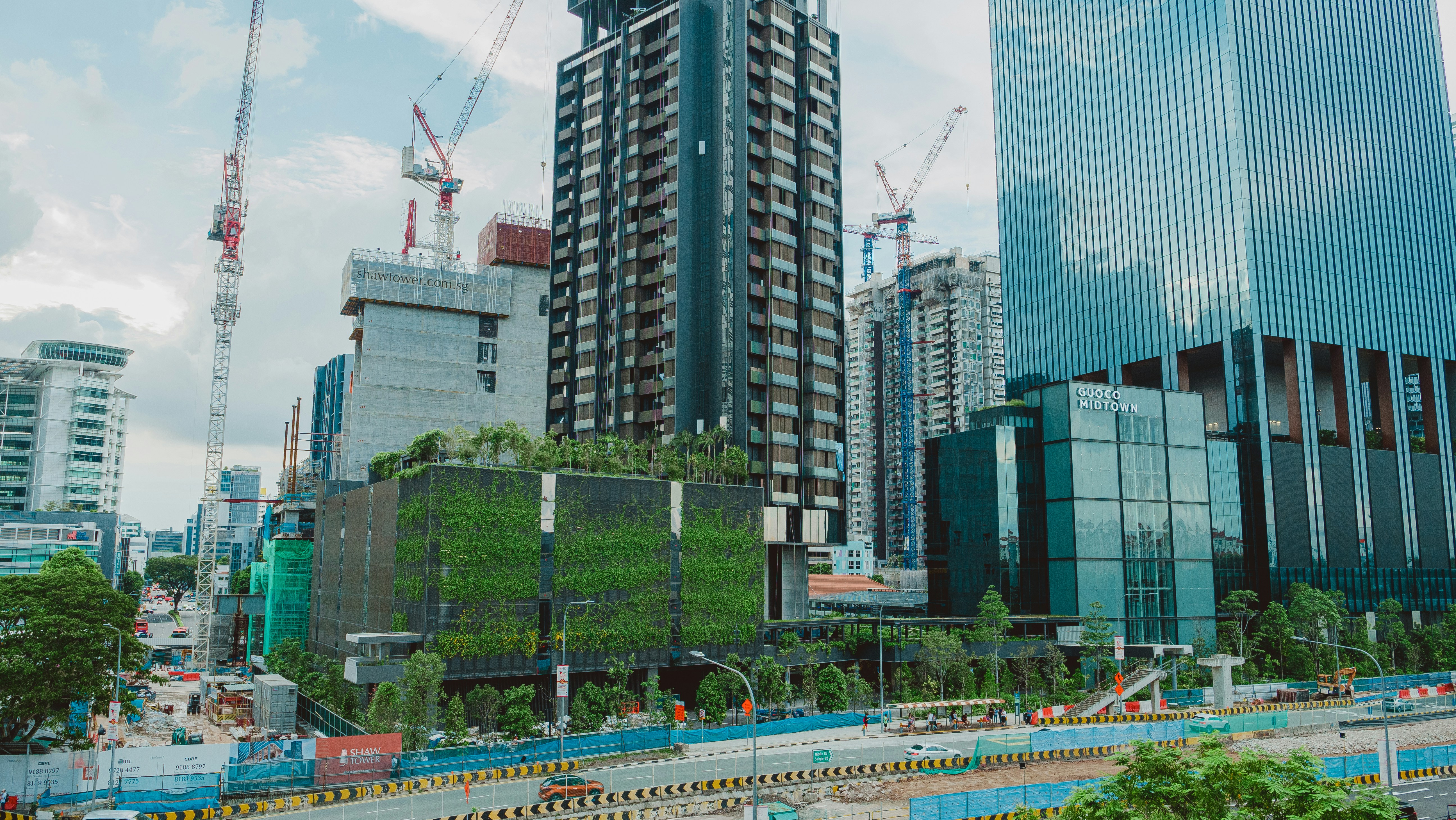 Skyscrapers and construction cranes in the city.