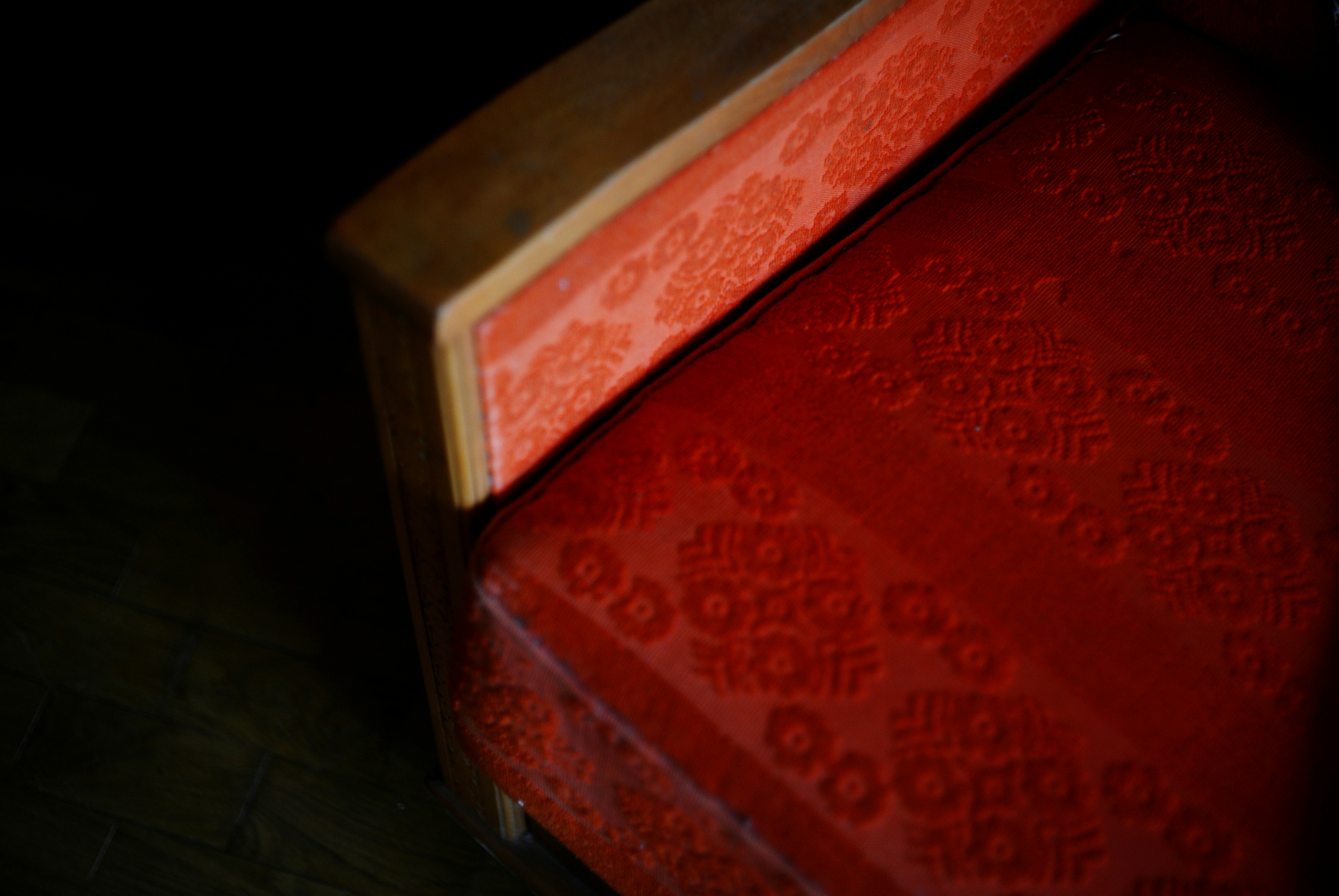 A close-up of a red armchair.