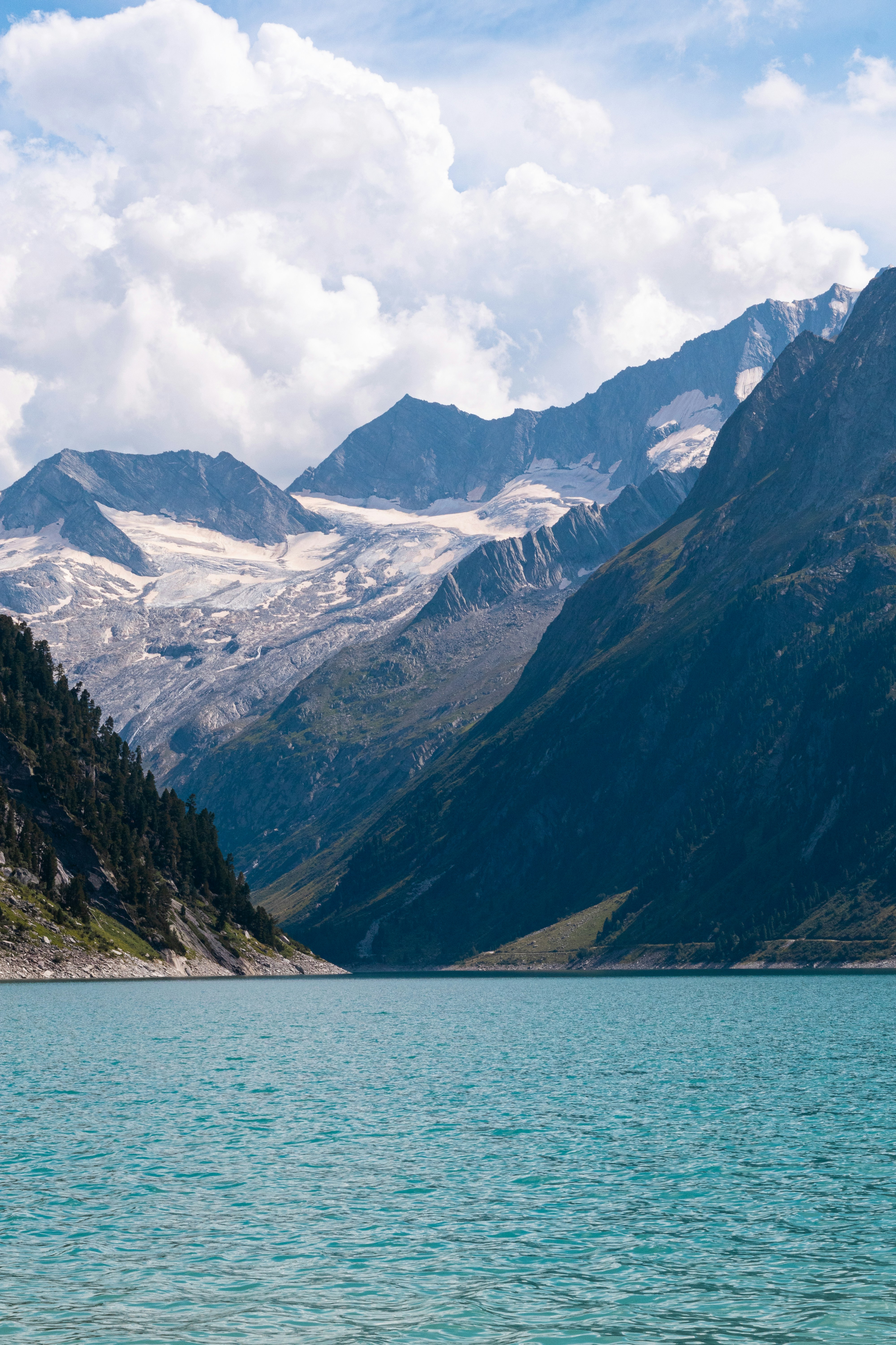 Mountains rise above a serene lake.