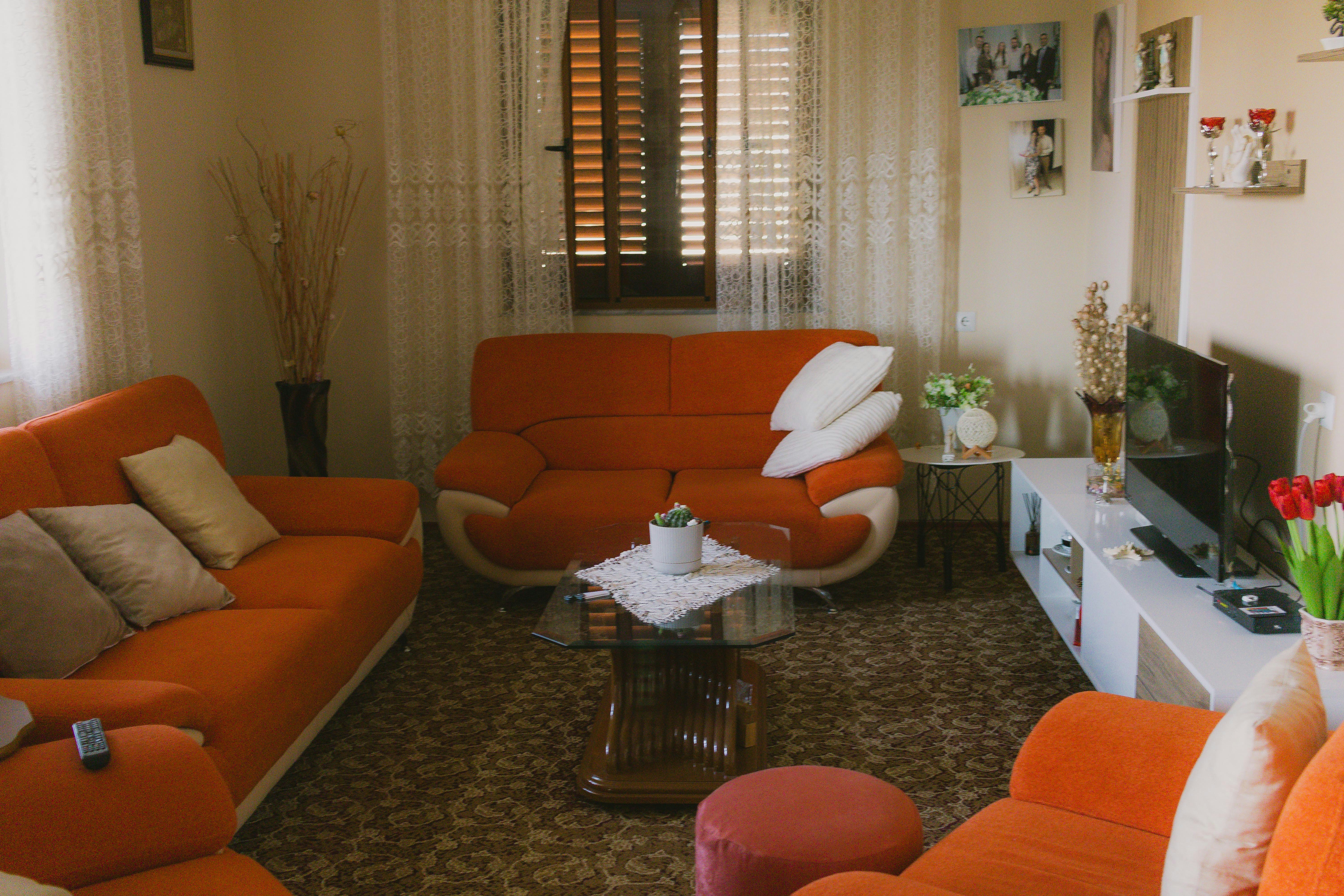 Cozy and warm living room with orange furniture.