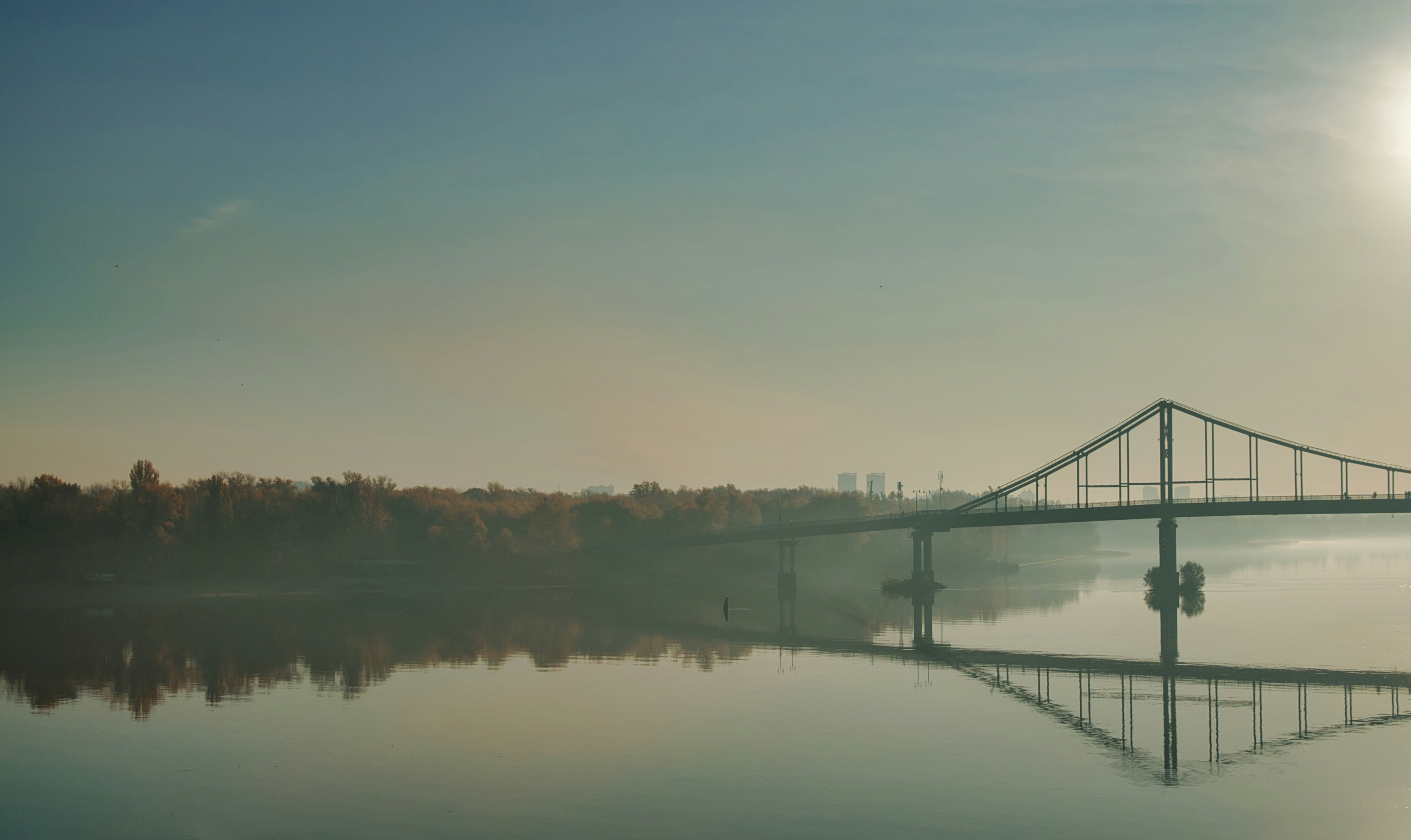 Serenity at Dawn: The Bridge Reflection