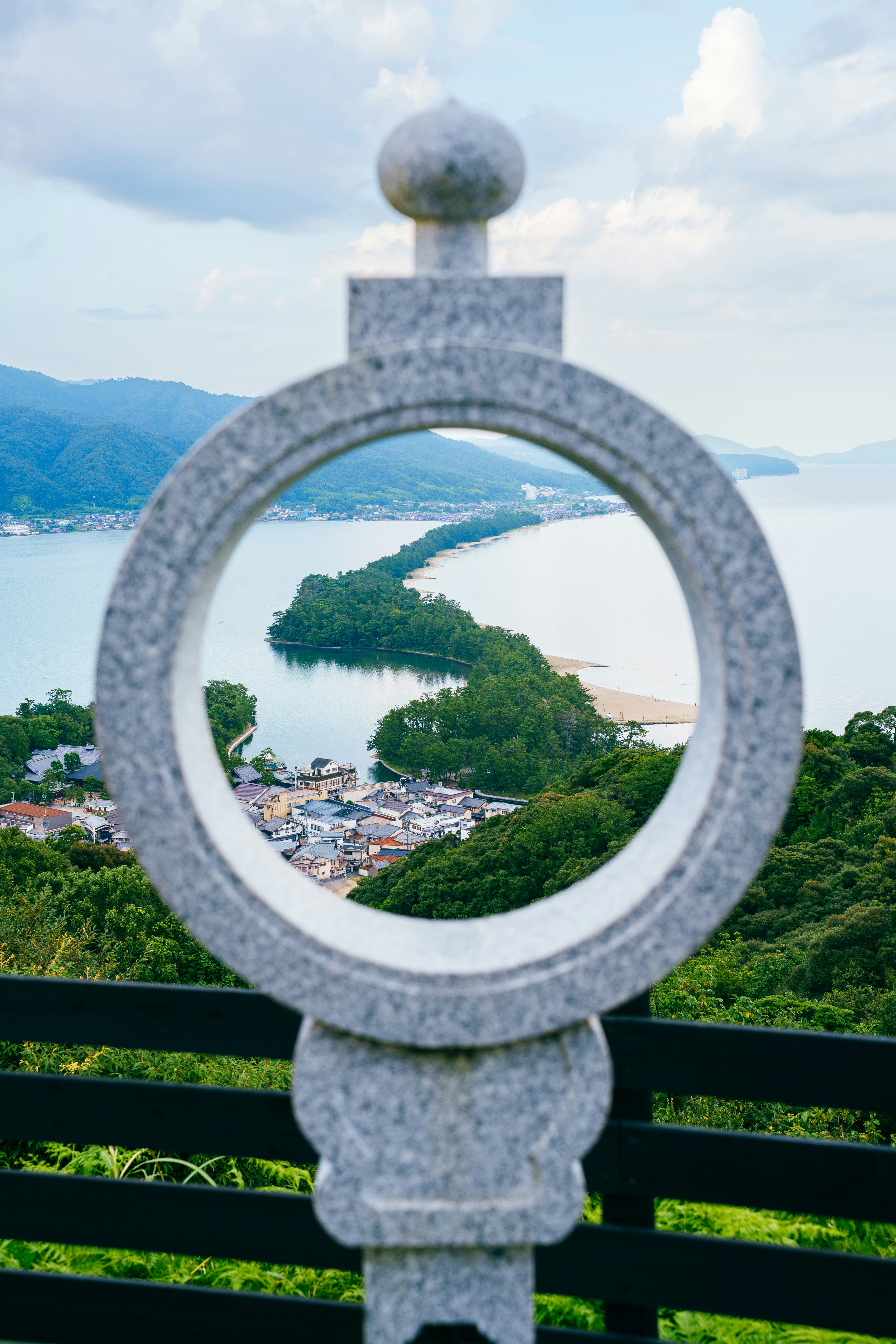 Beautiful island seen through a stone sculpture.