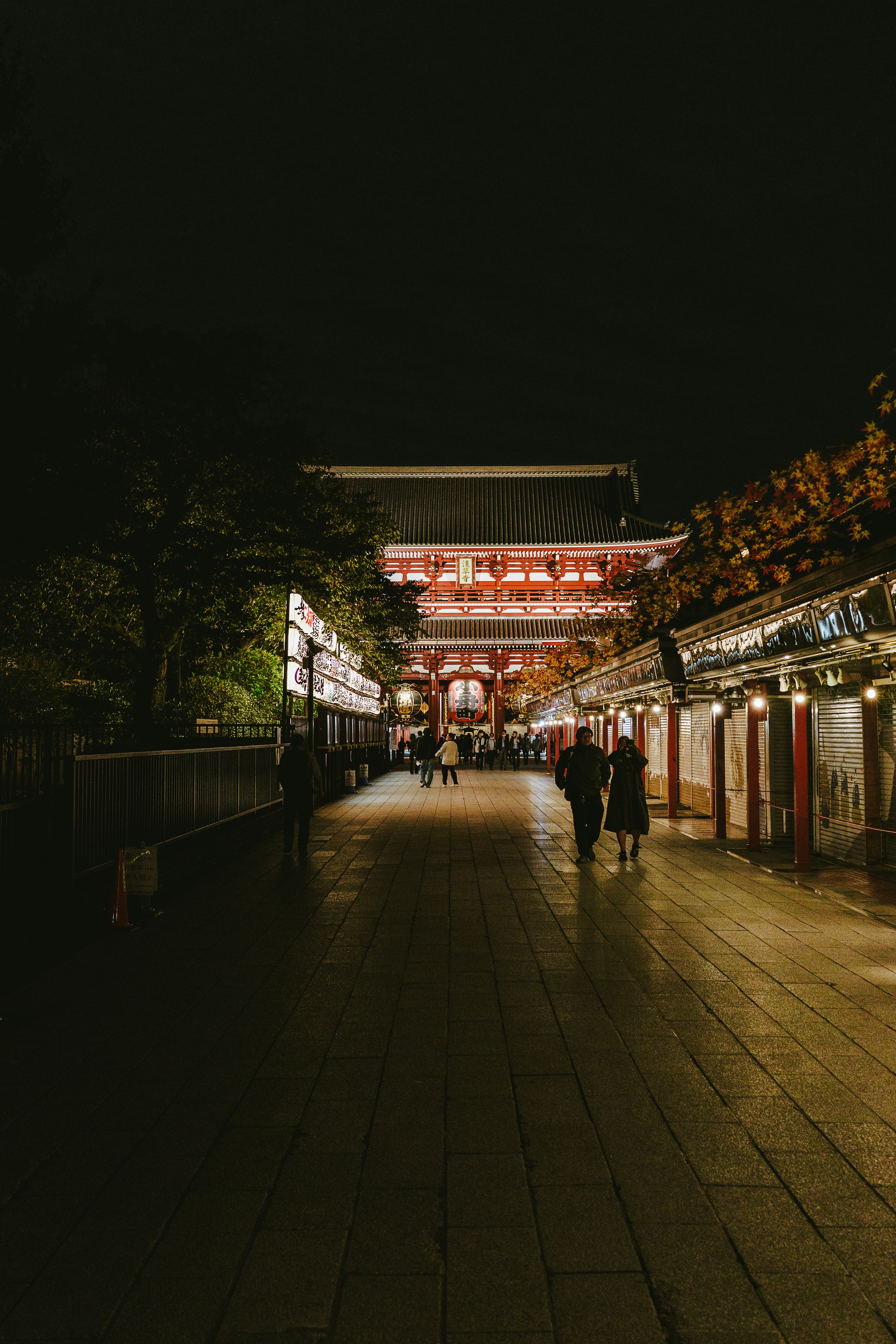 A nighttime view of a temple in japan.