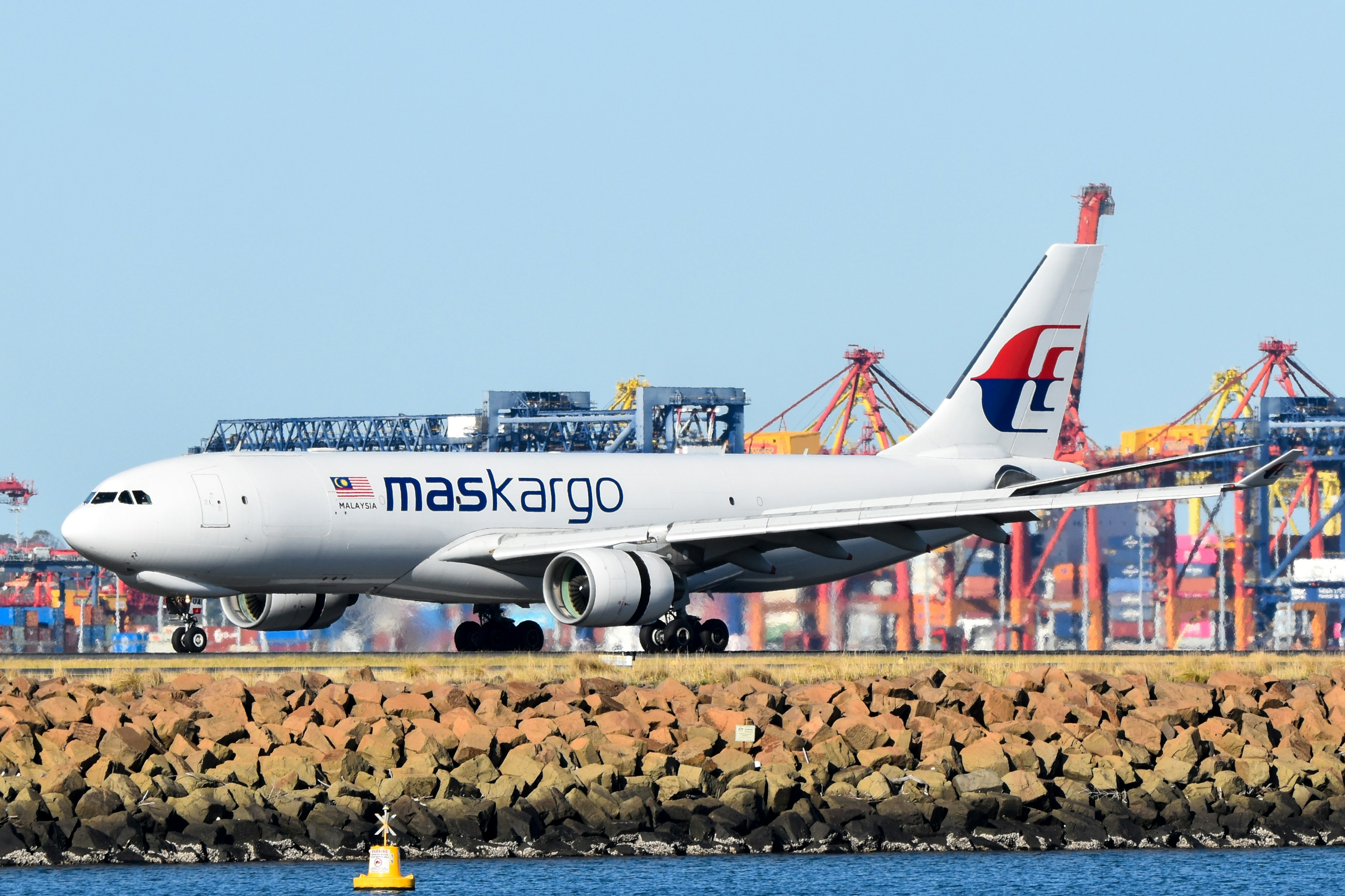 A maskargo cargo plane is on the runway. photo – Free Airplane Image on ...