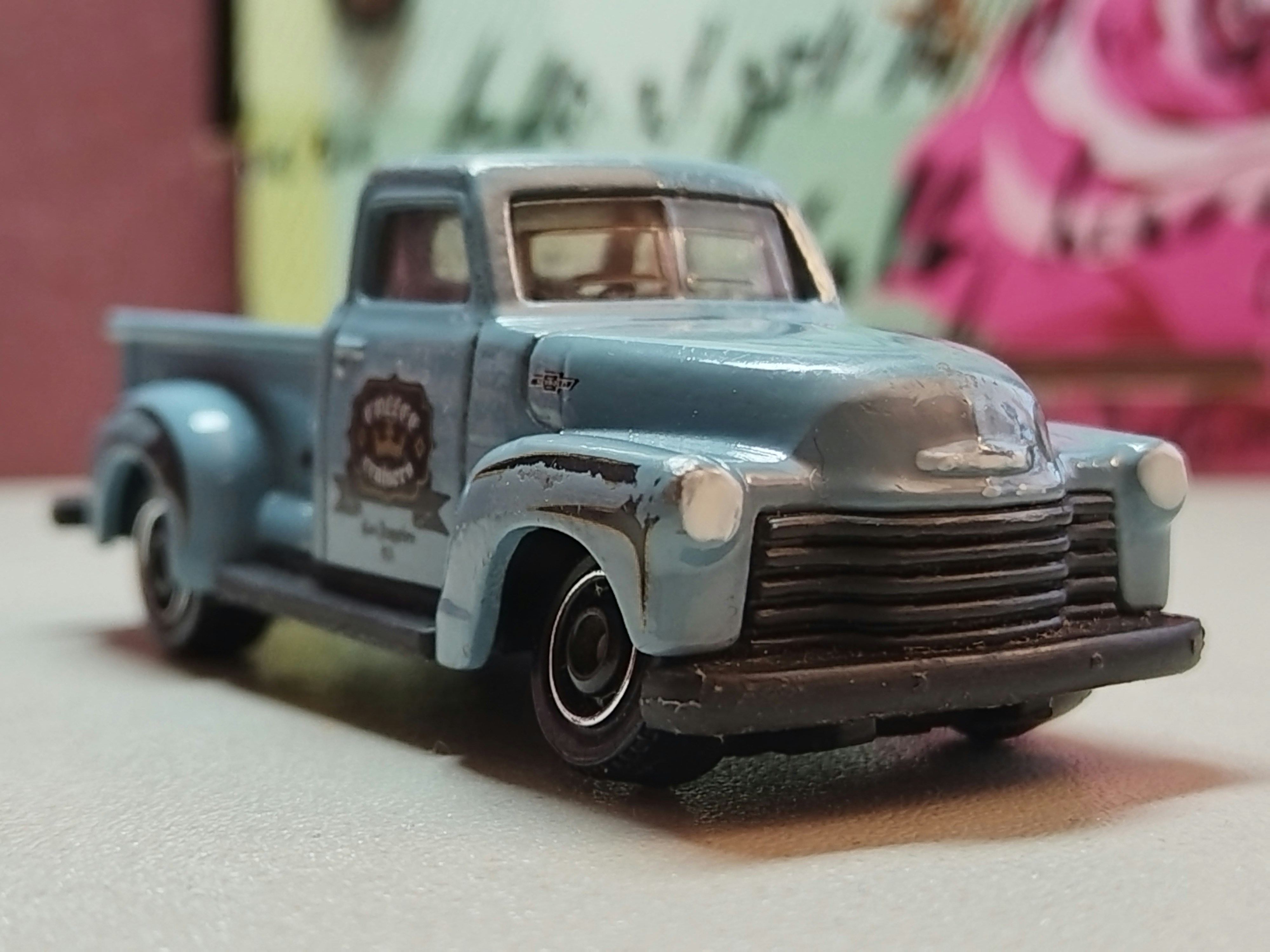Matchbox 47 Chevy AD Truck | Here's a caption: a blue toy truck sits in the image.