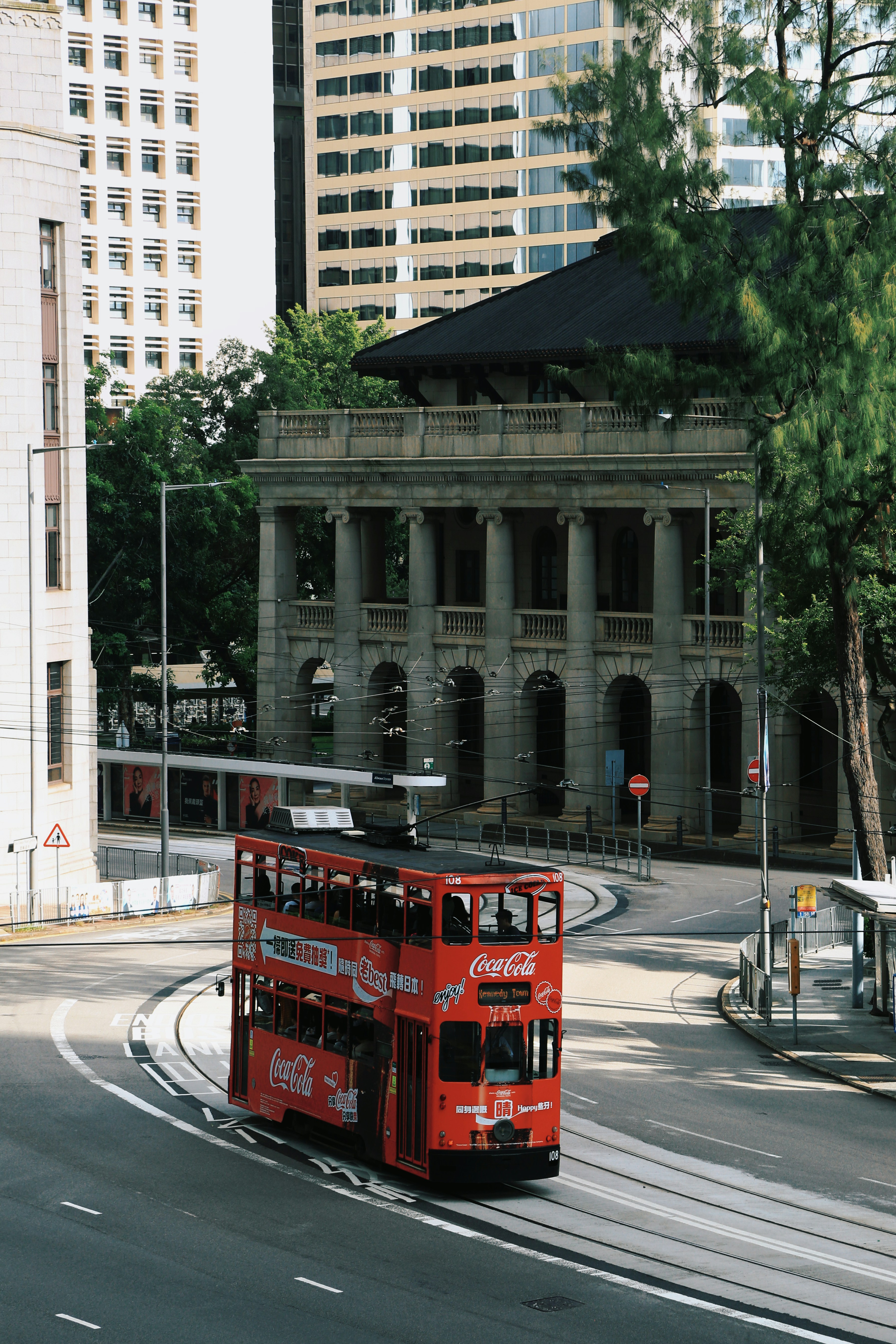 Urban Harmony: A Red Tram's Journey Through Time