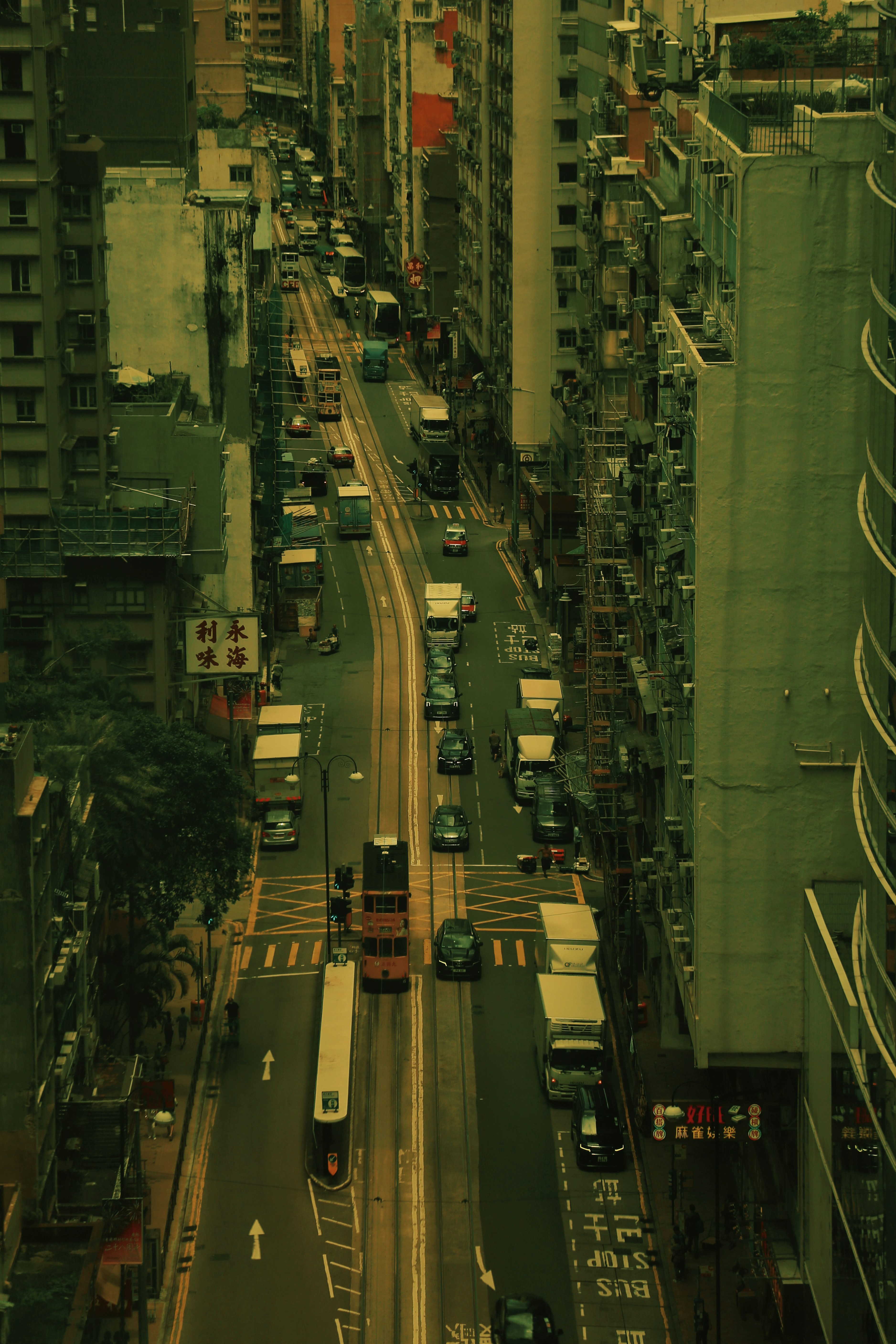 A busy street scene with transportation and buildings.