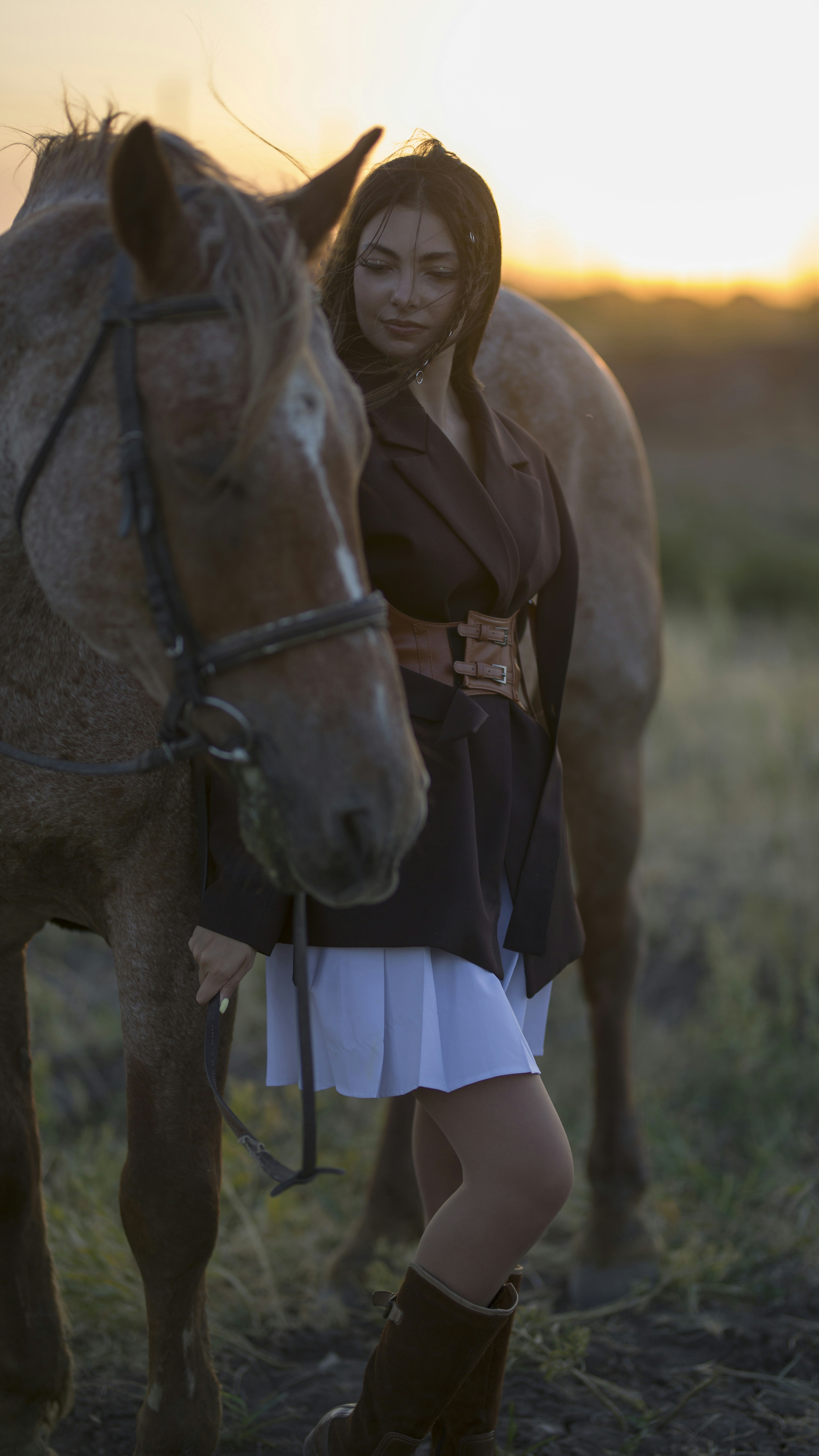 Dusk Companions: A Quiet Portrait of a Woman and Her Horse at Golden Hour