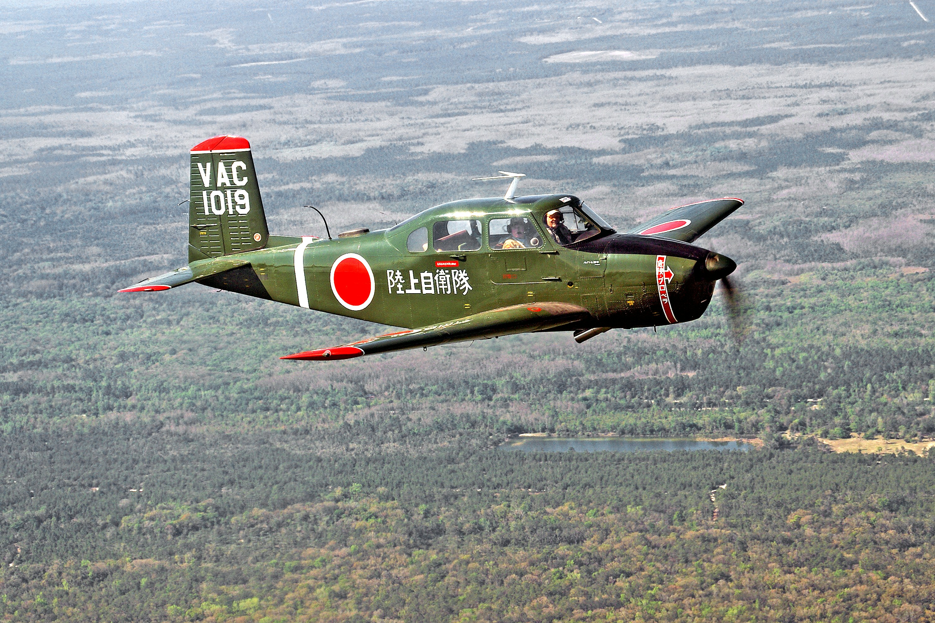 A rare 1950 Fuji LM-1 vintage airplane flies over Florida | A japanese trainer aircraft soars through the sky.