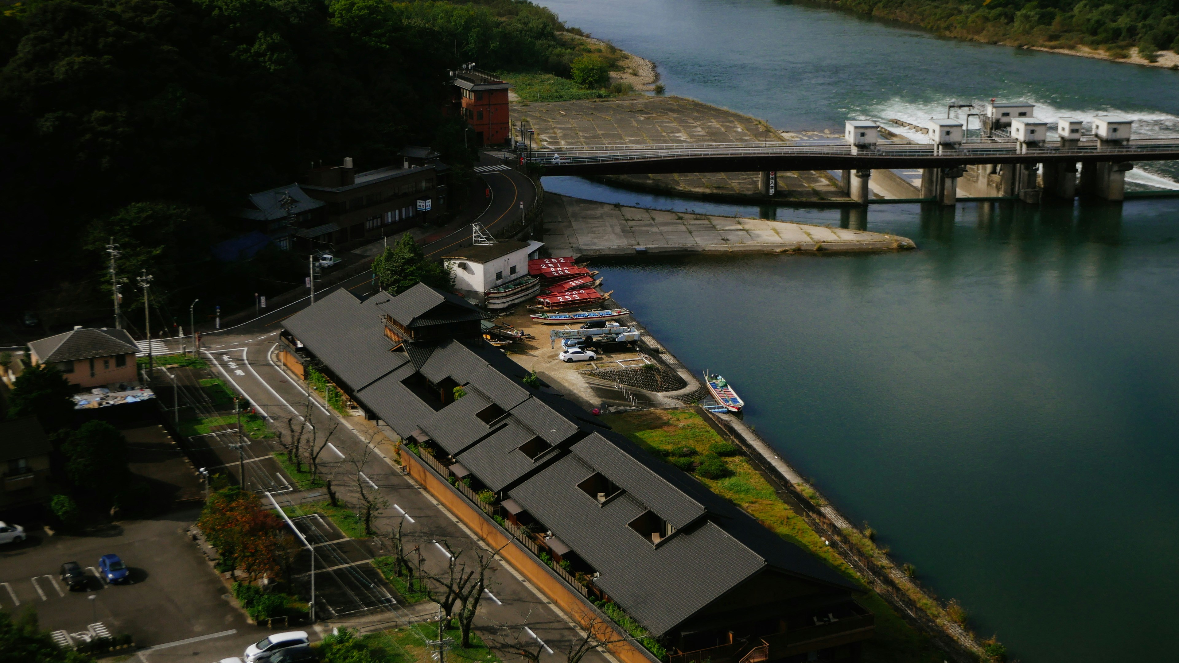 An aerial view of a dam and buildings.