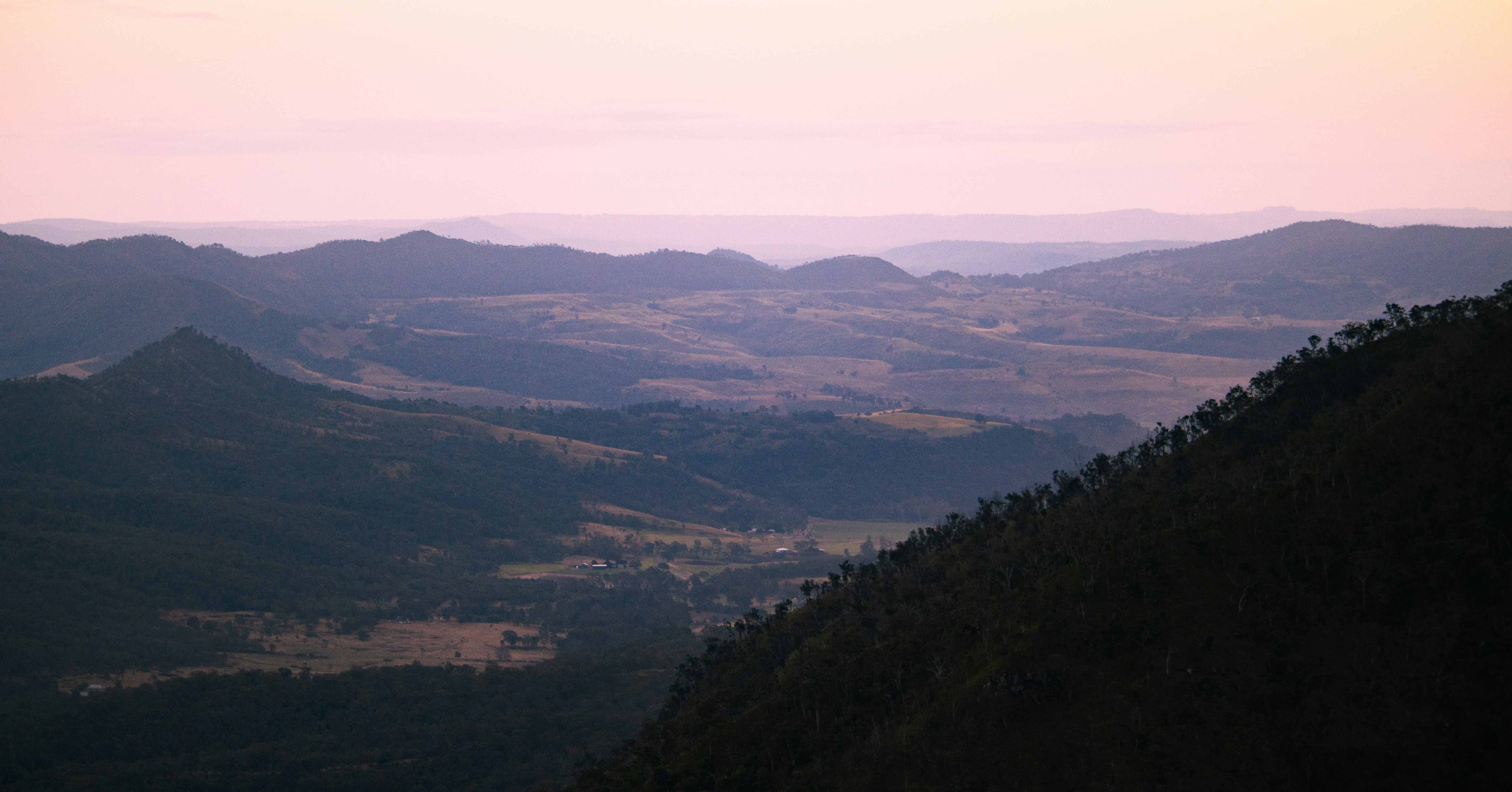 Twilight's Embrace Over Rolling Hills