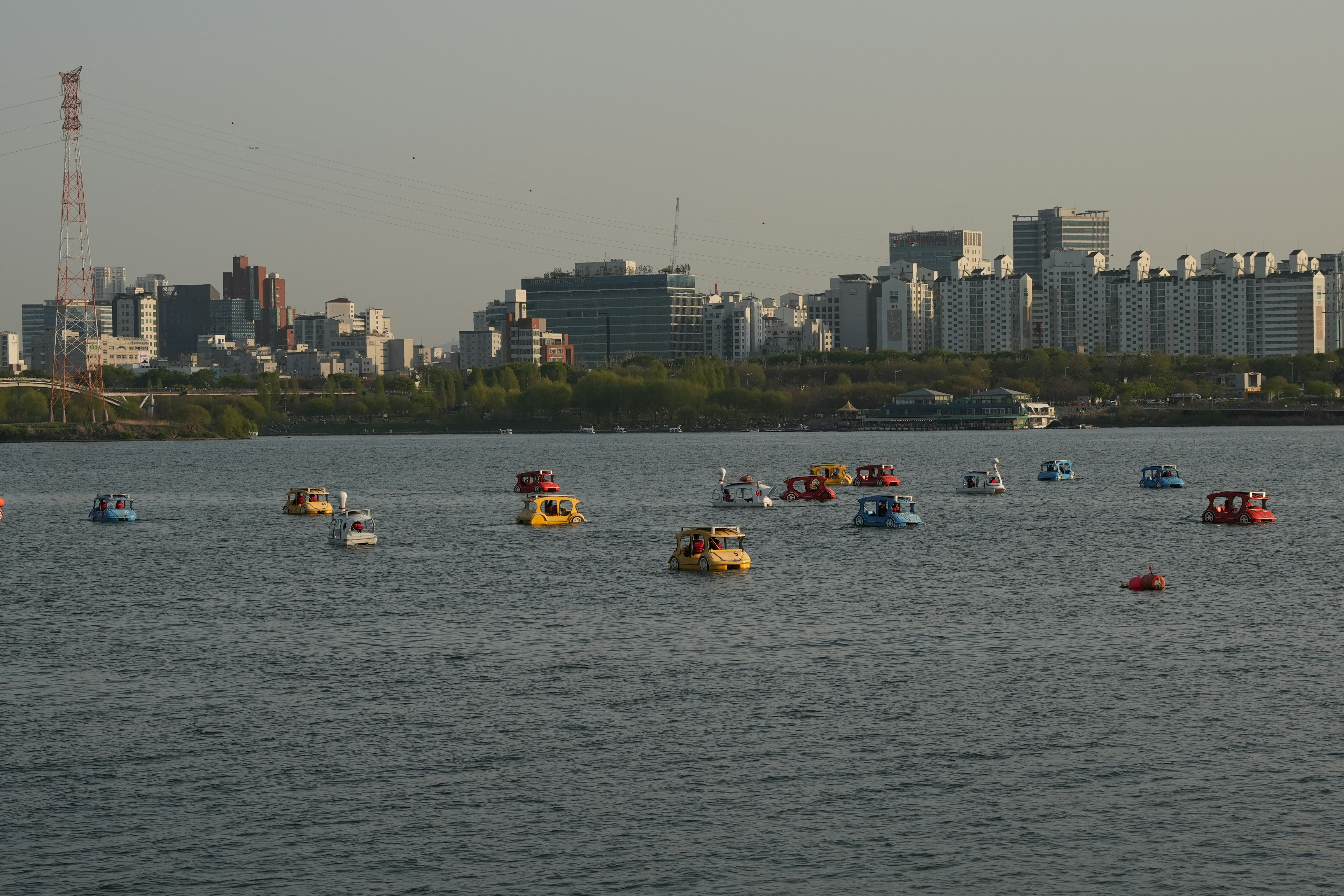 Colorful Pedal Boats Amidst Urban Serenity