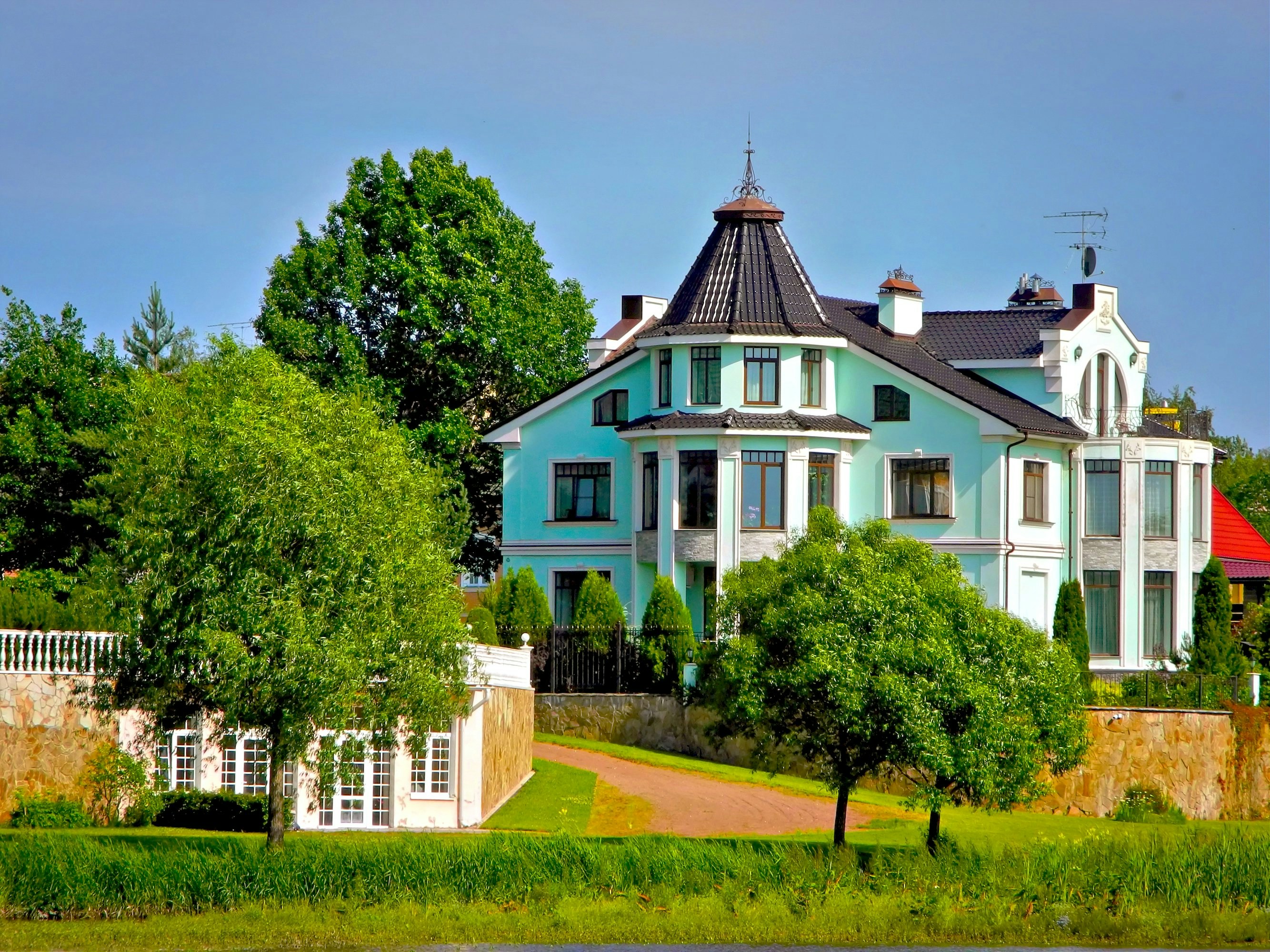 A beautiful, colorful house surrounded by greenery. photo – Free ...