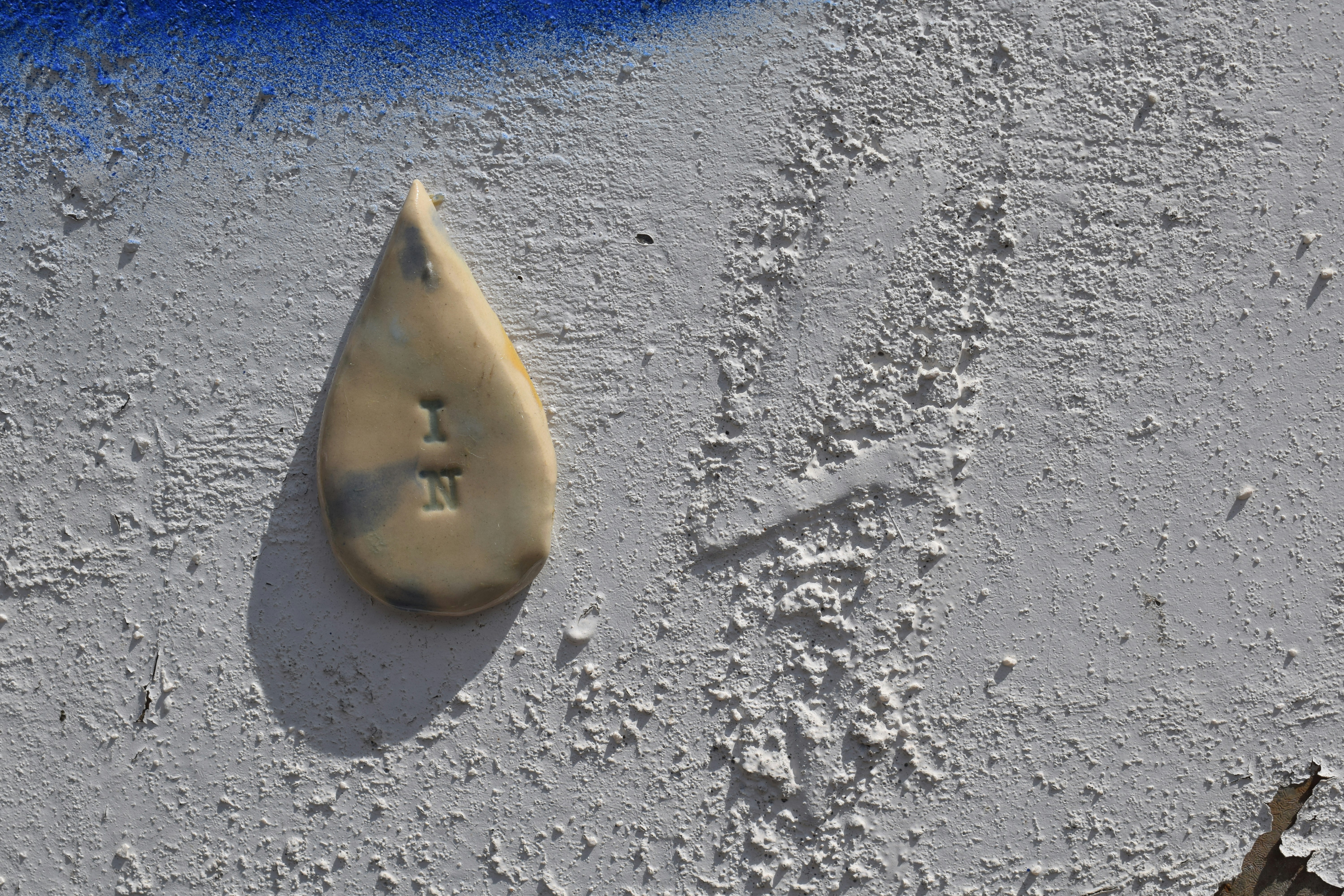 The Droplet's Story on Weathered Canvas