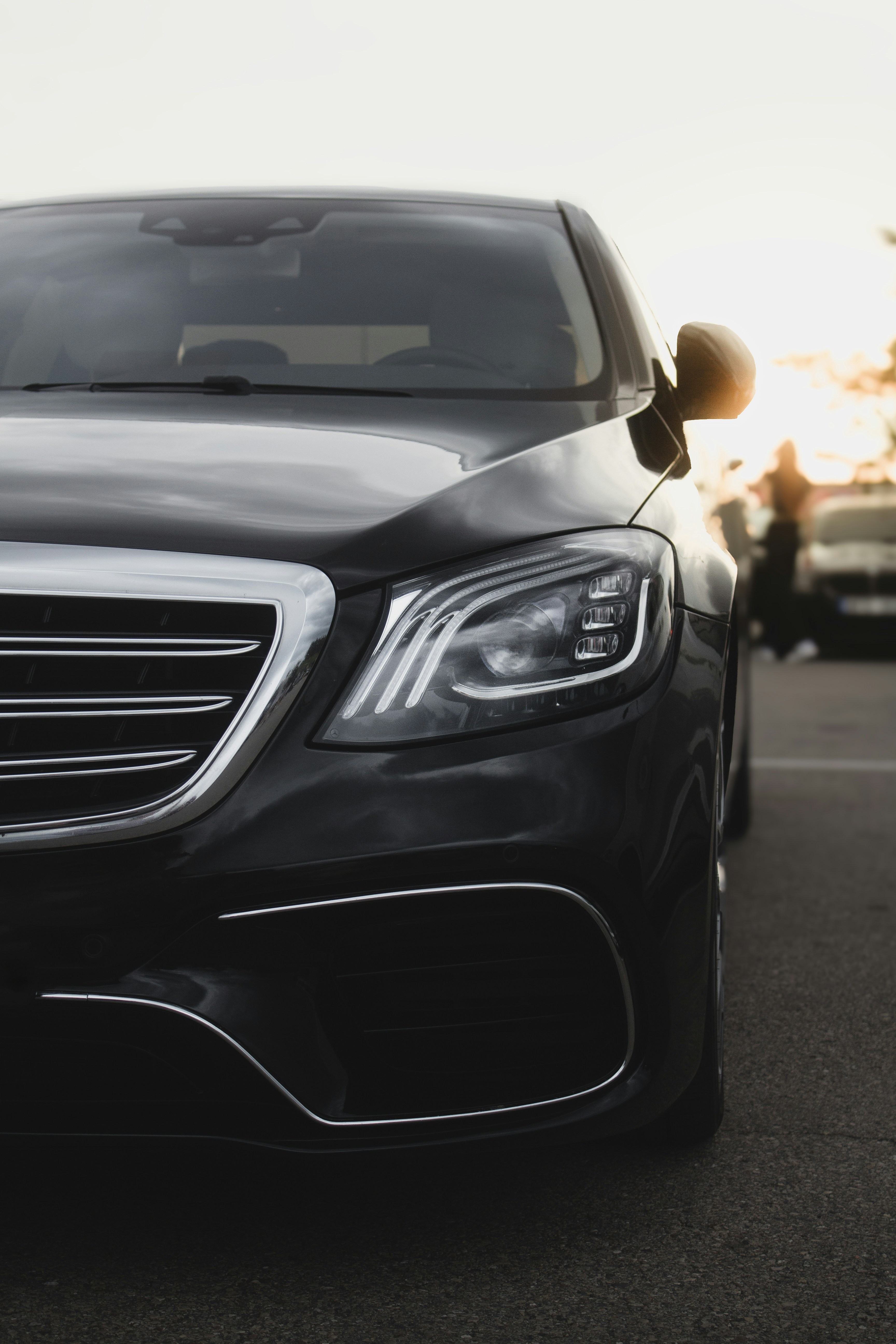 Mercedes S63 AMG W222 | A sleek, black car gleams in the sunlight.