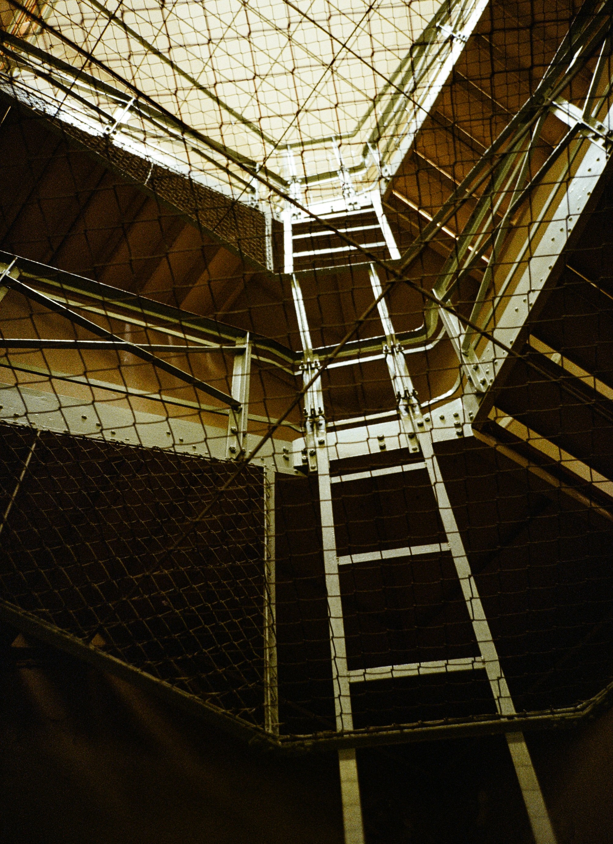 Looking up a spiral staircase.