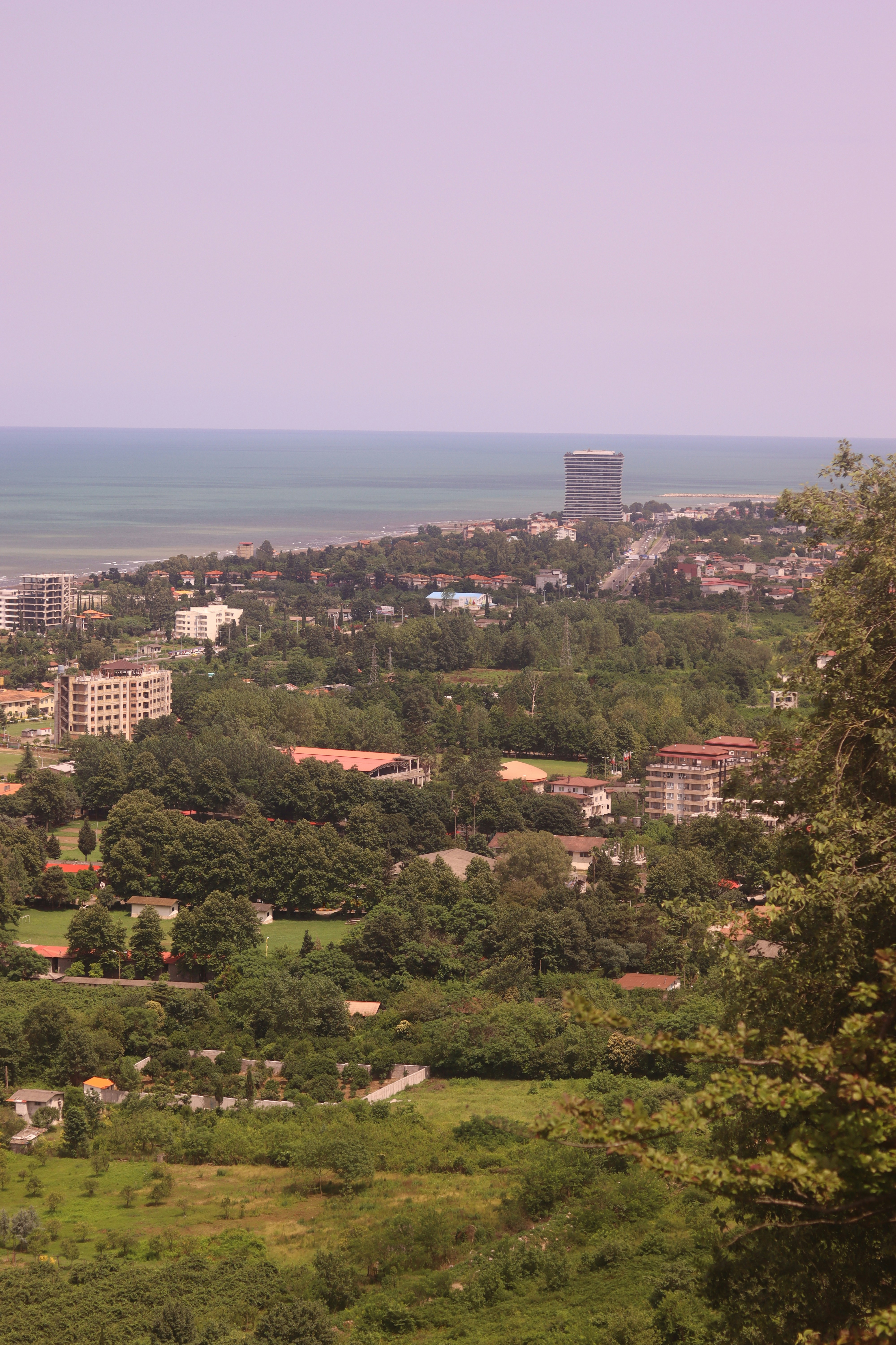 A cityscape overlooking the sea.