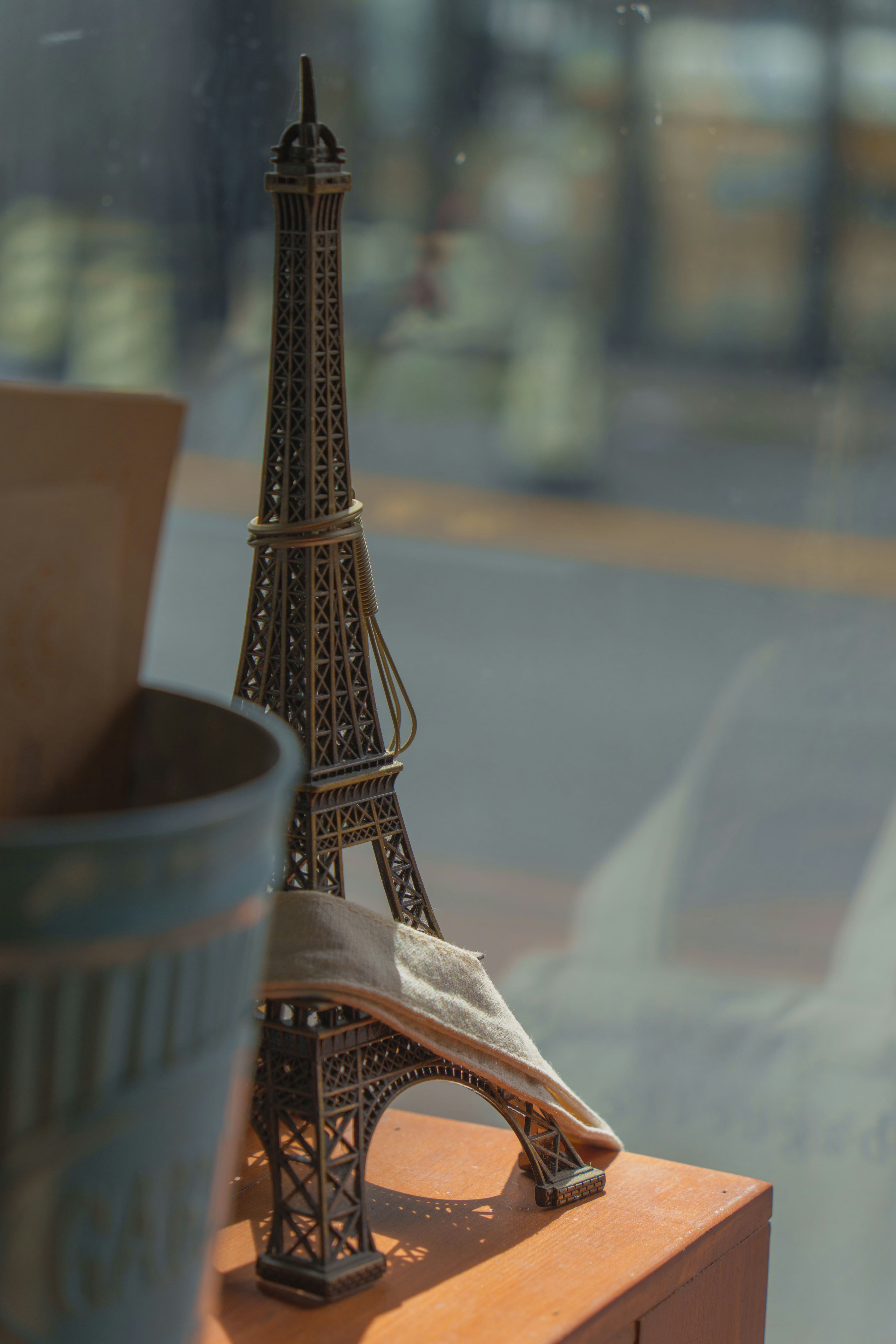 A miniature eiffel tower is on display. photo – Free Eiffel tower Image ...