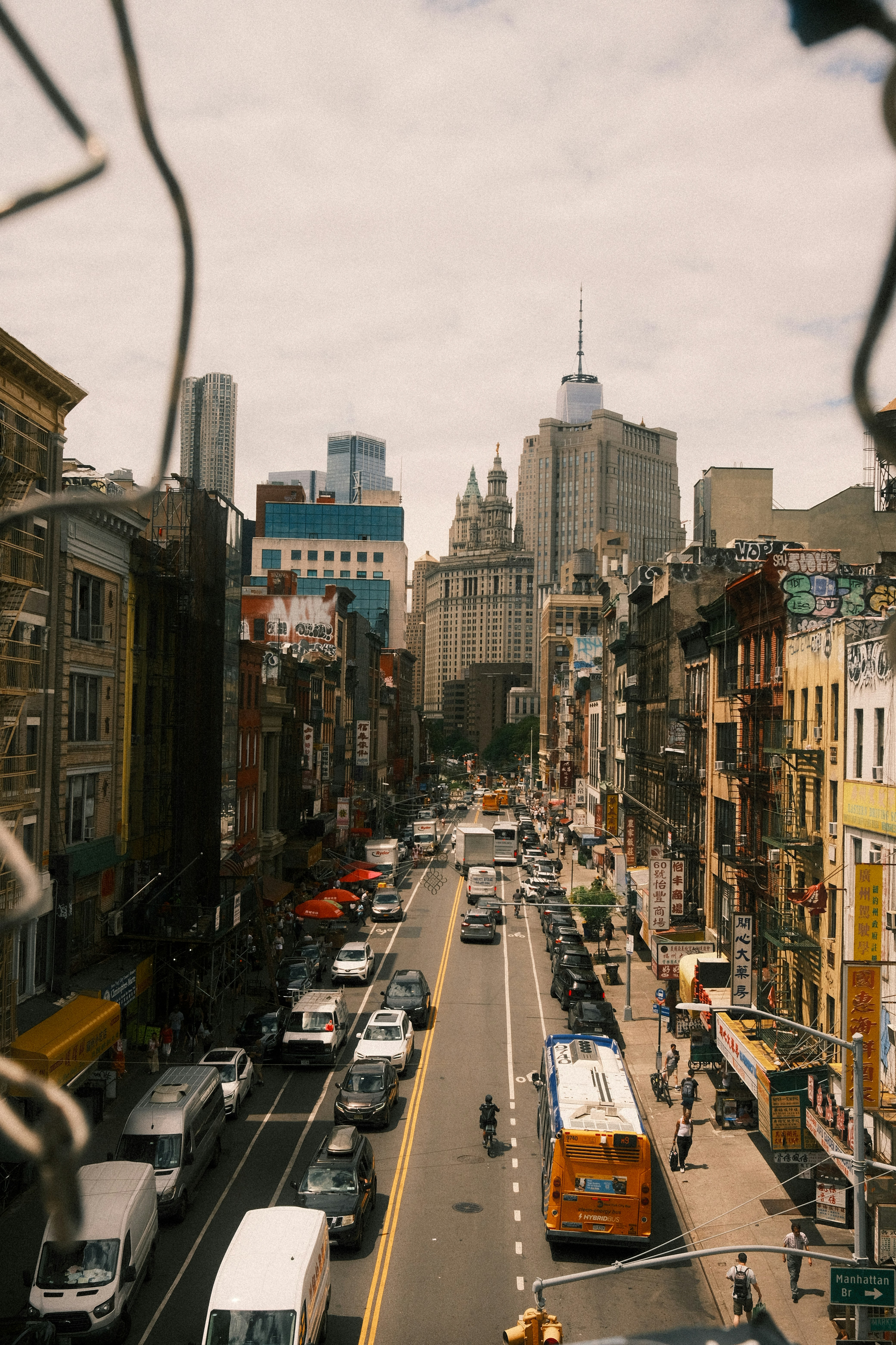 Bustling street scene in a vibrant urban setting, showcasing a mix of historical and modern architecture against a lively thoroughfare.