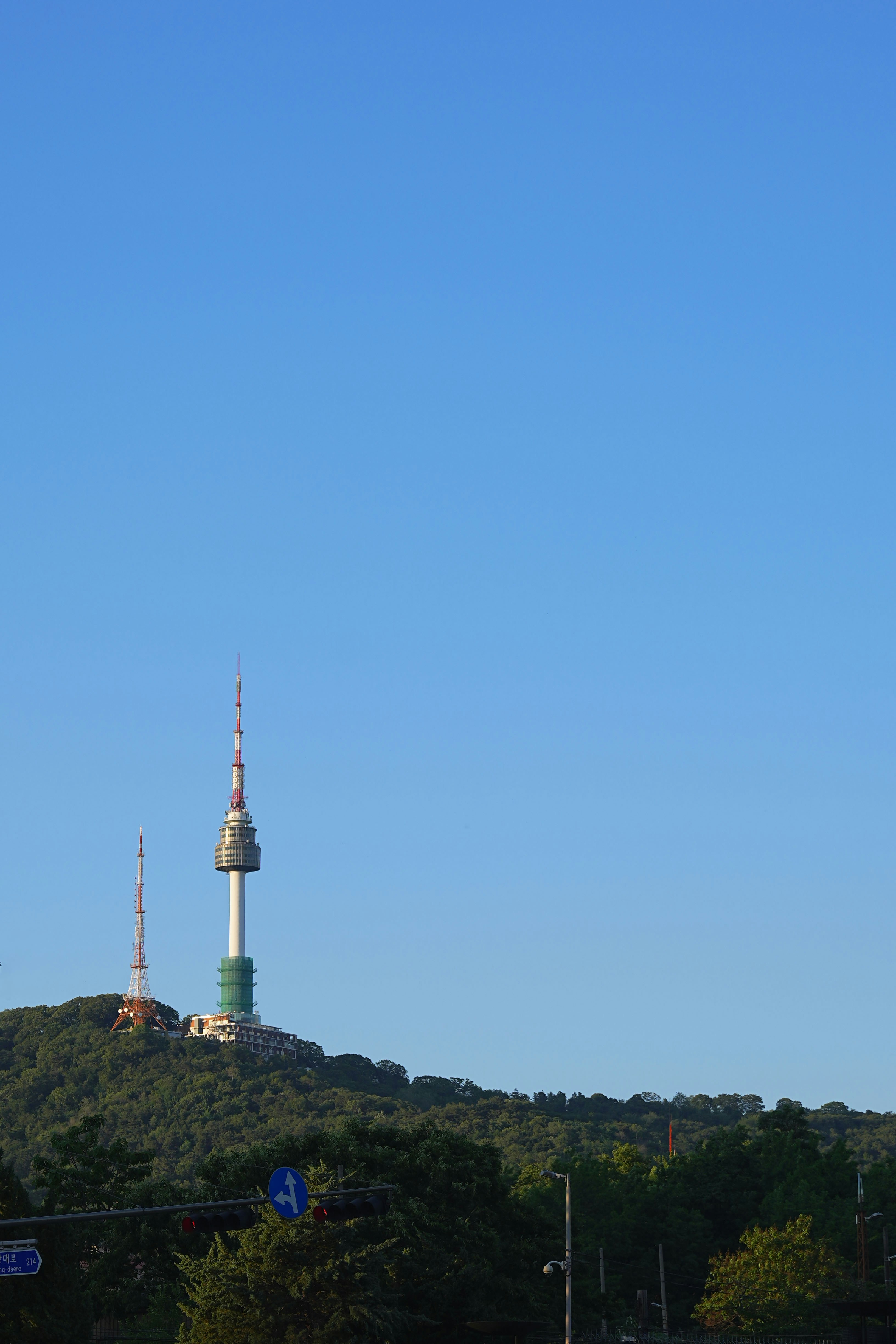 2025 남산 타워 | The seoul tower is silhouetted against a blue sky.