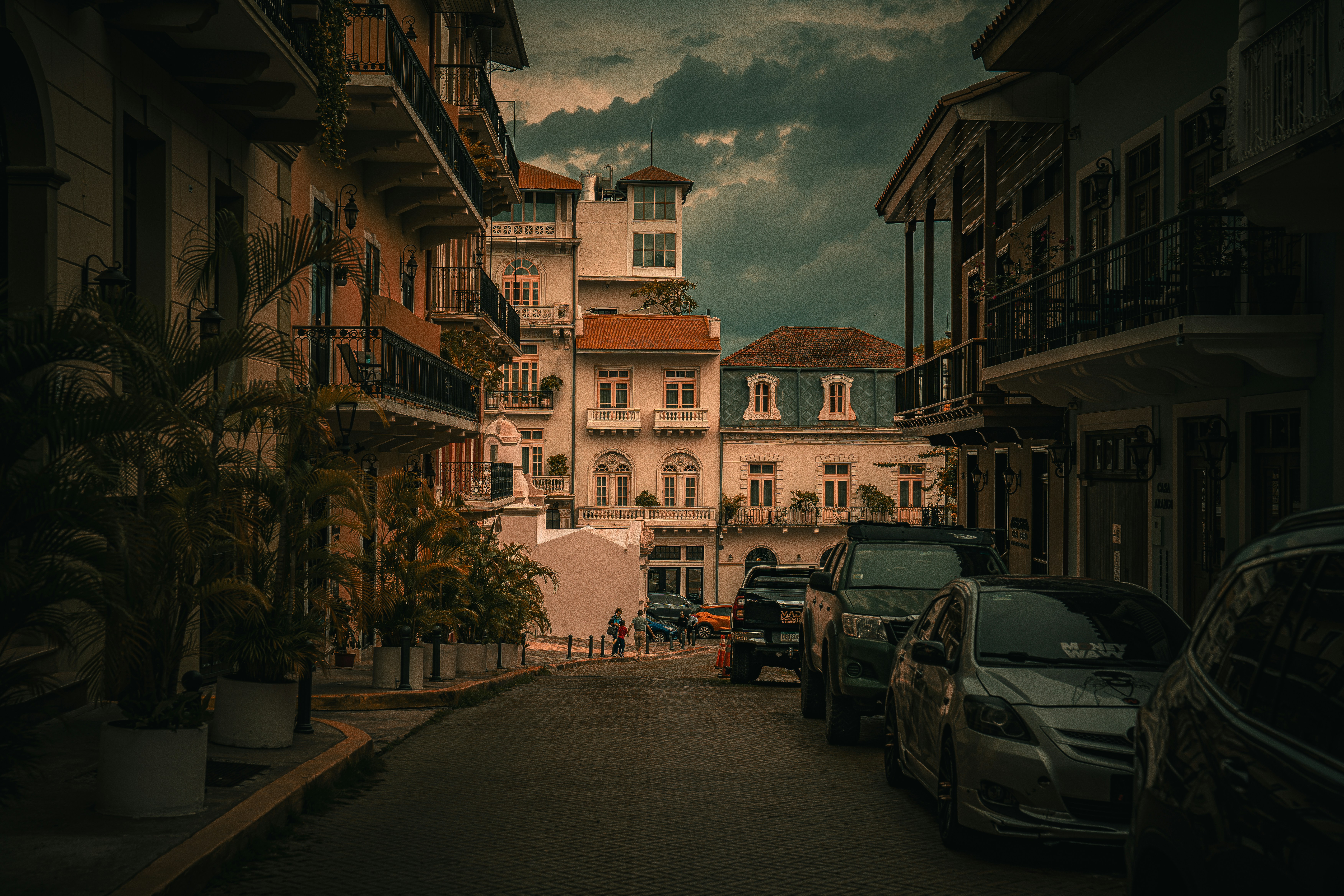 A street lined with beautiful buildings and cars.