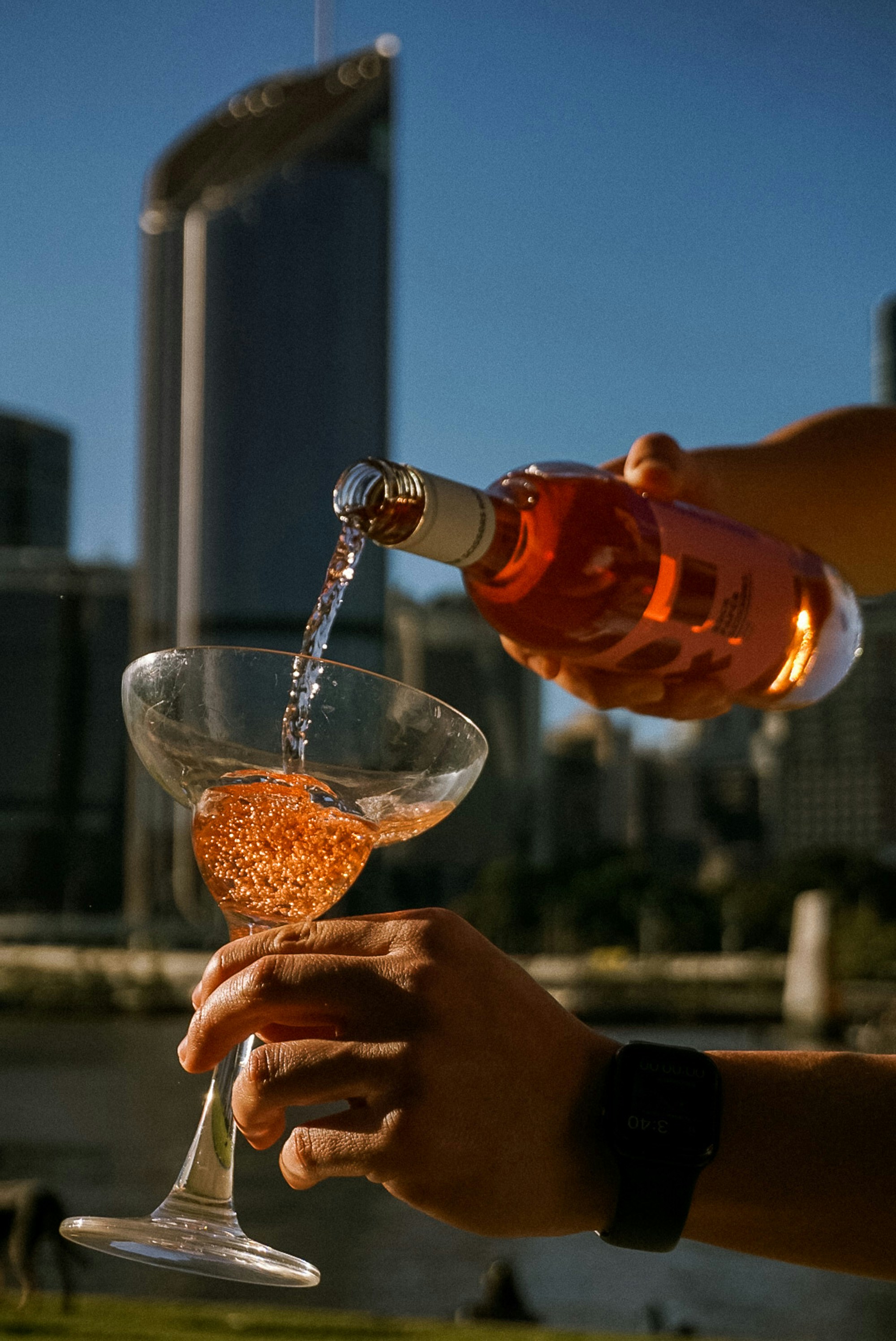 Rosé wine being poured into a glass.