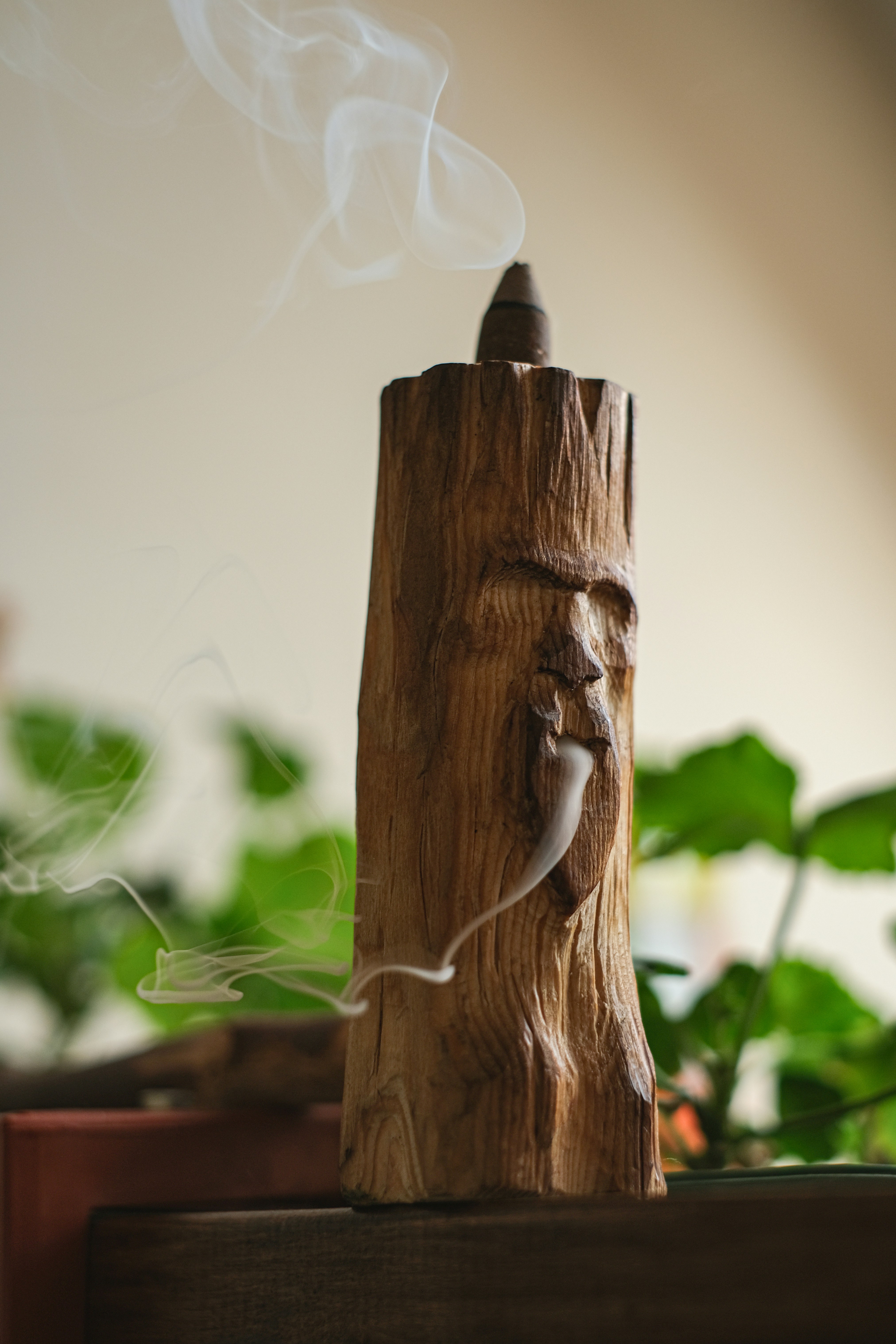 Whispering Torch: A Carved Timber Figure Now Perfumed by Smoke